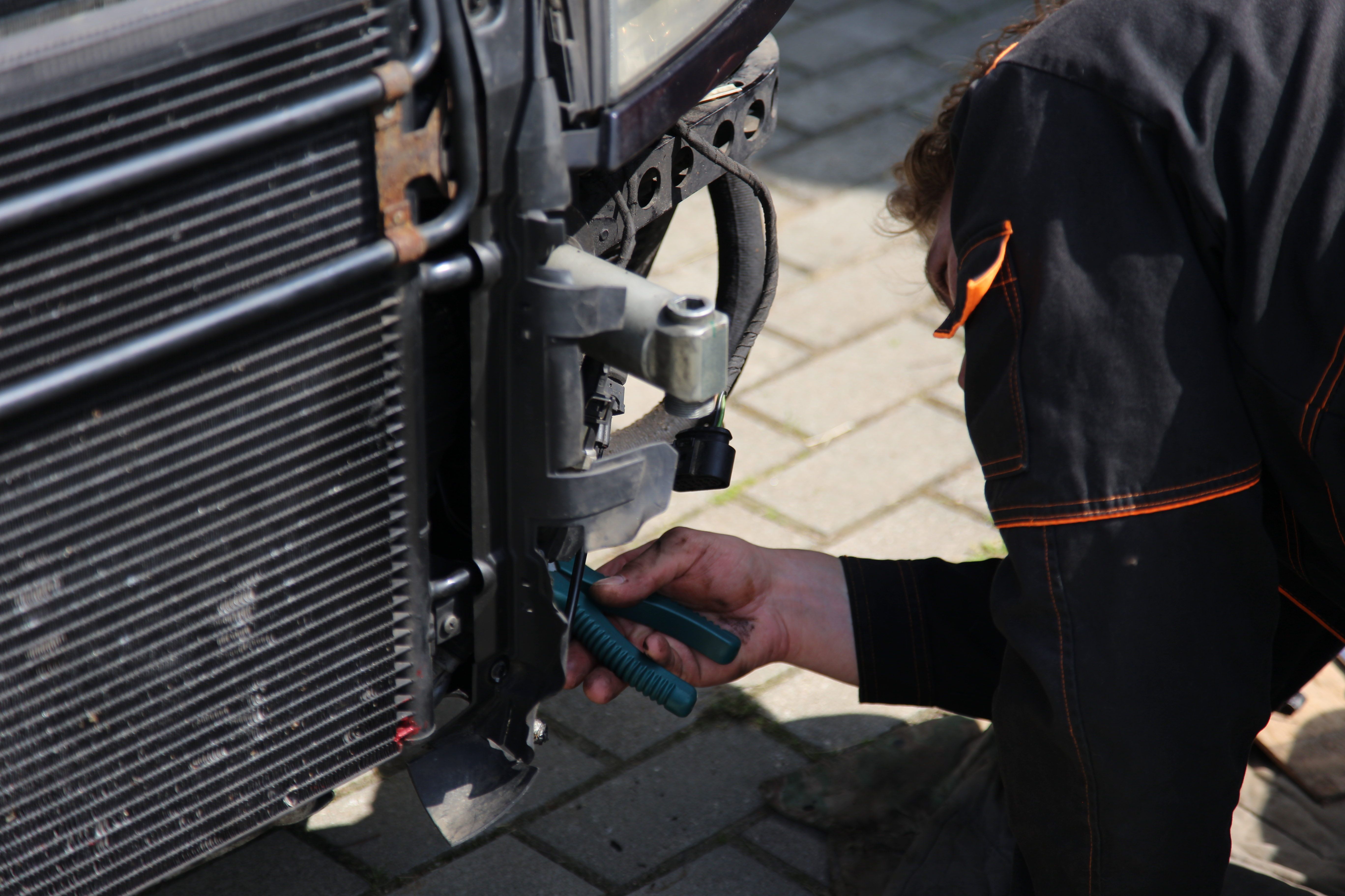 Auto Mechanic Repairing Car with Tools Outdoors · Free Stock Photo