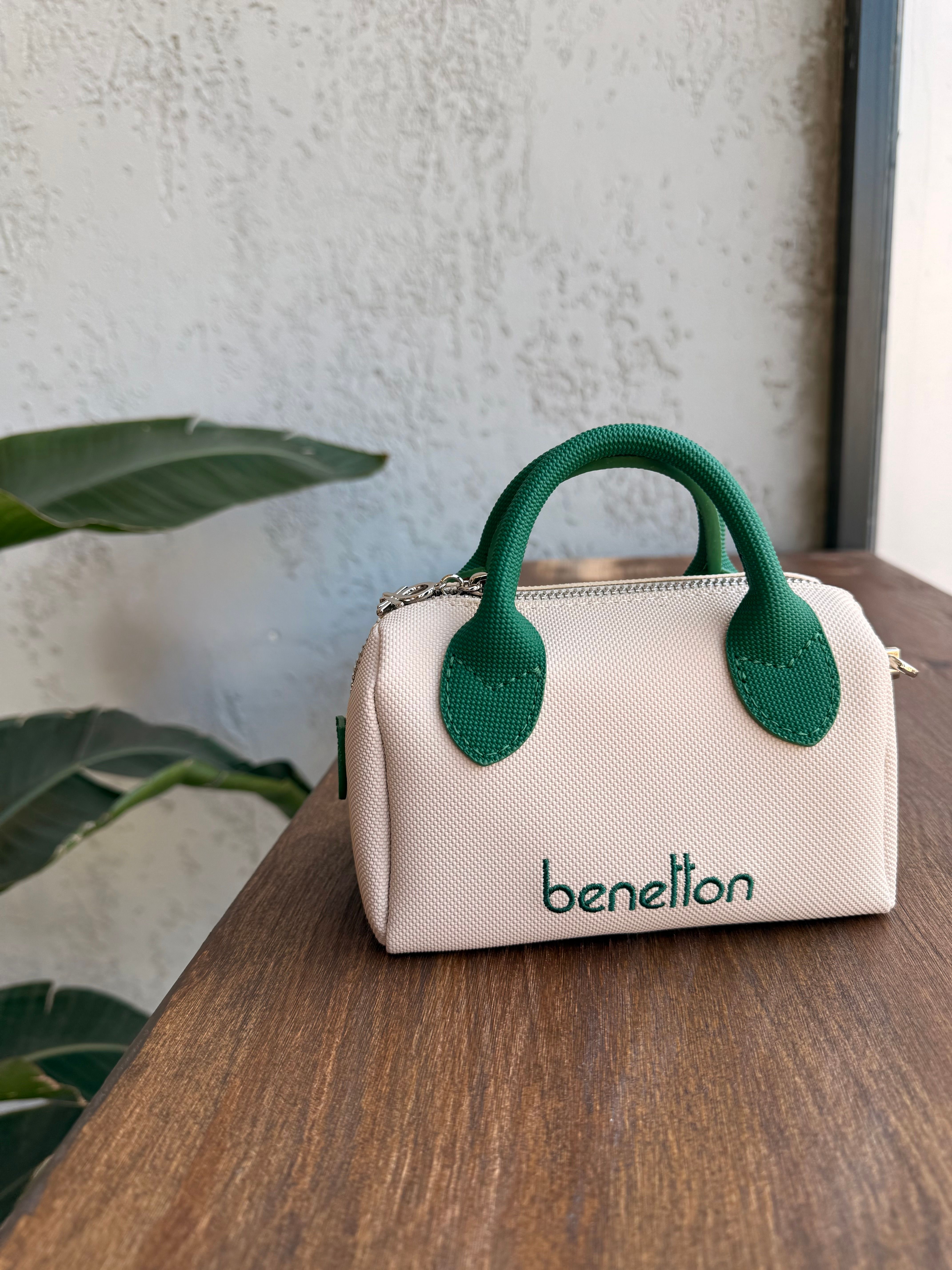Stylish Beige Mini Handbag with Green Handles · Free Stock Photo
