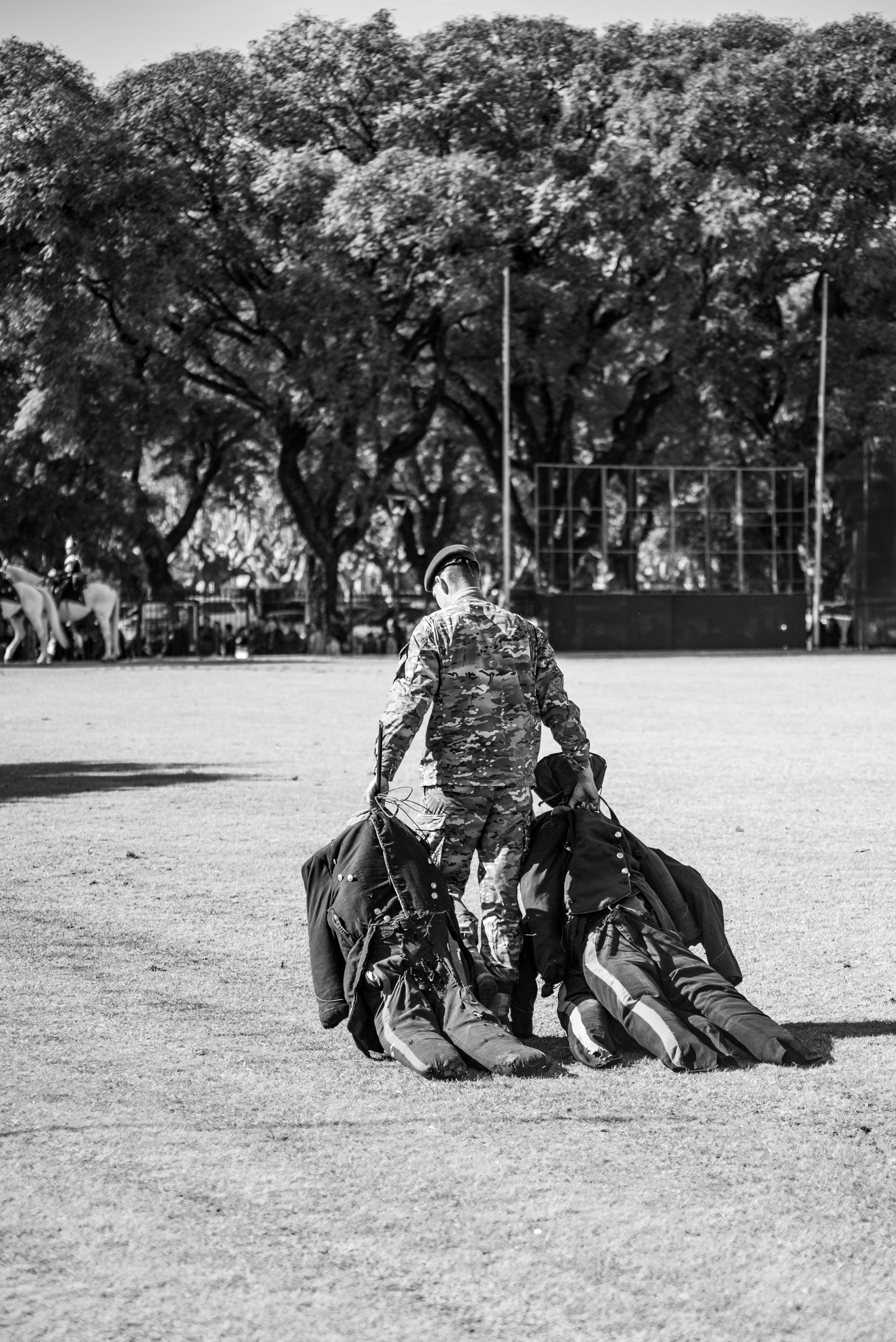 Soldier Carrying Parachutes in Black and White · Free Stock Photo