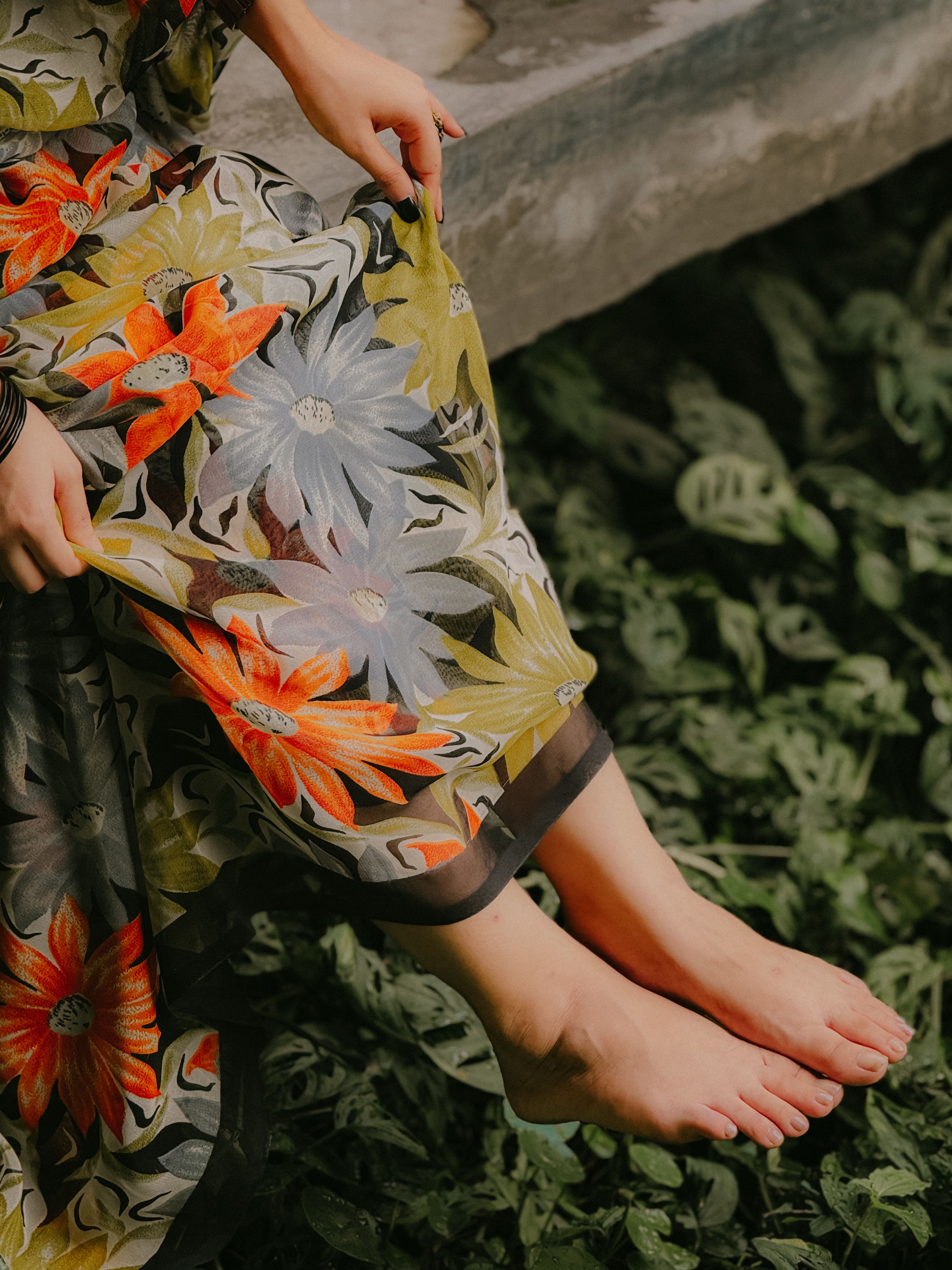 Elegant Floral Dress with Barefoot on Greenery · Free Stock Photo