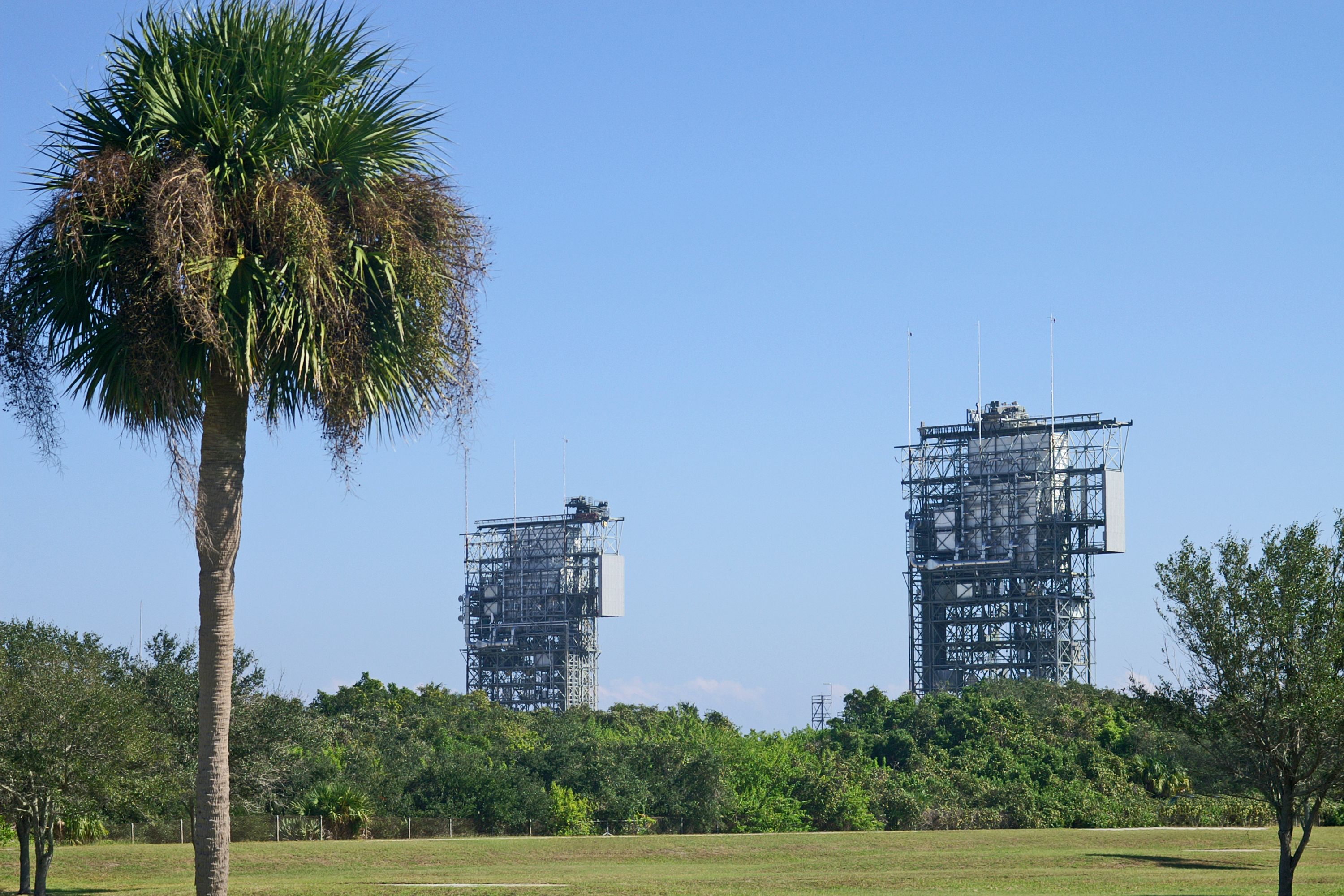 Cape Canaveral Launch Pads and Palm Tree · Free Stock Photo