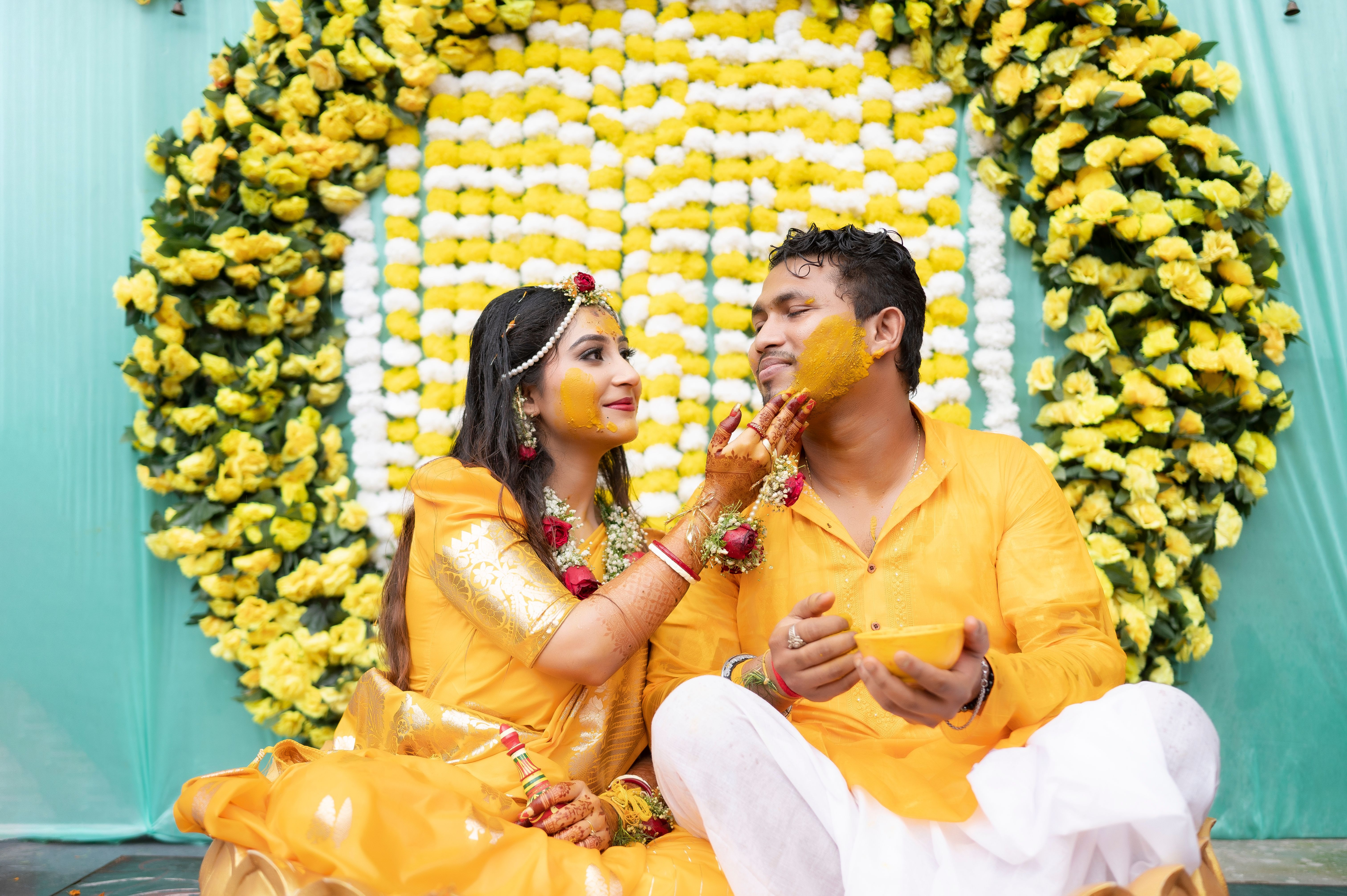 Vibrant Haldi Ceremony with Bride and Groom · Free Stock Photo