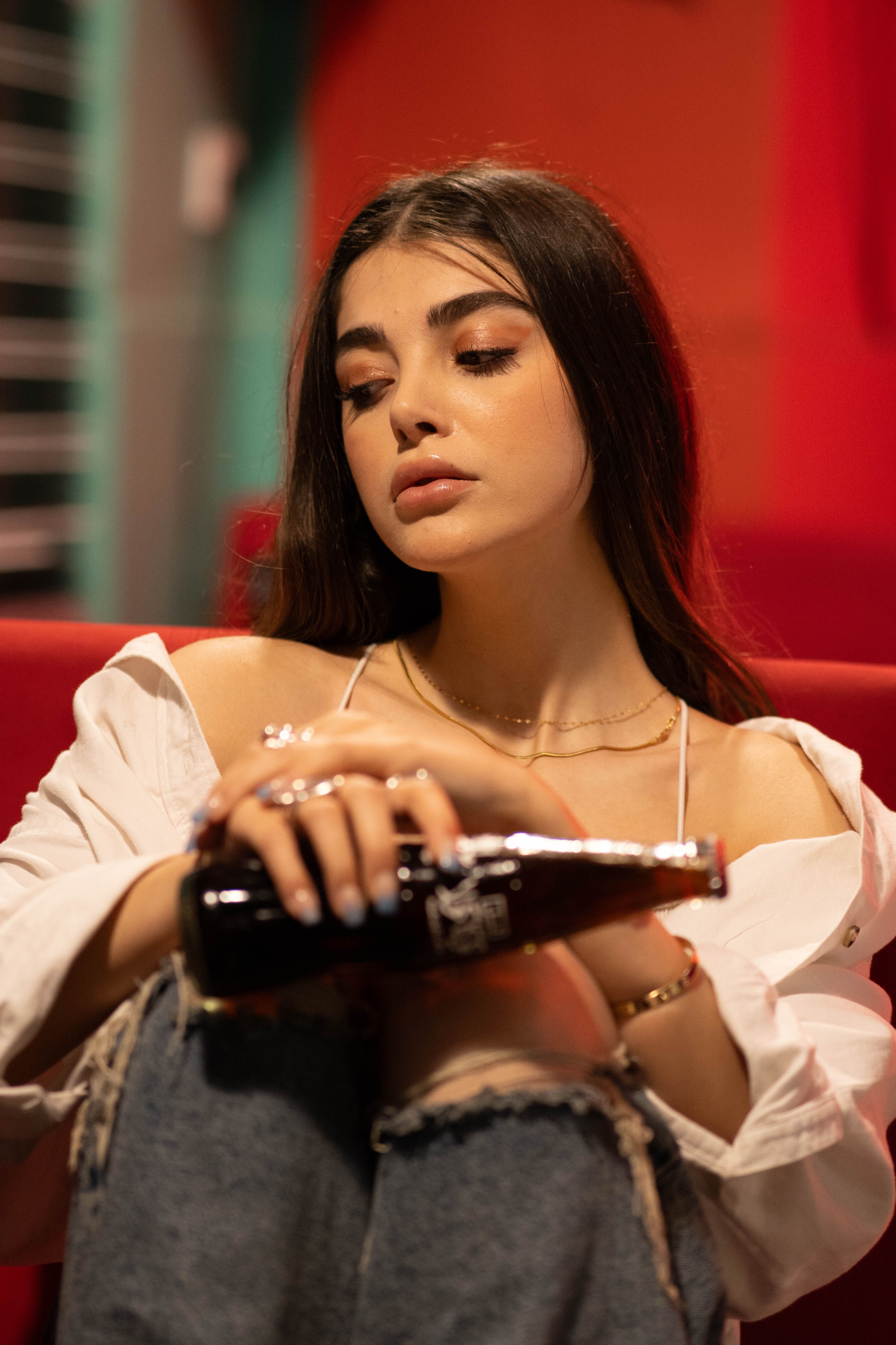 Relaxed Portrait of a Young Woman with Drink · Free Stock Photo
