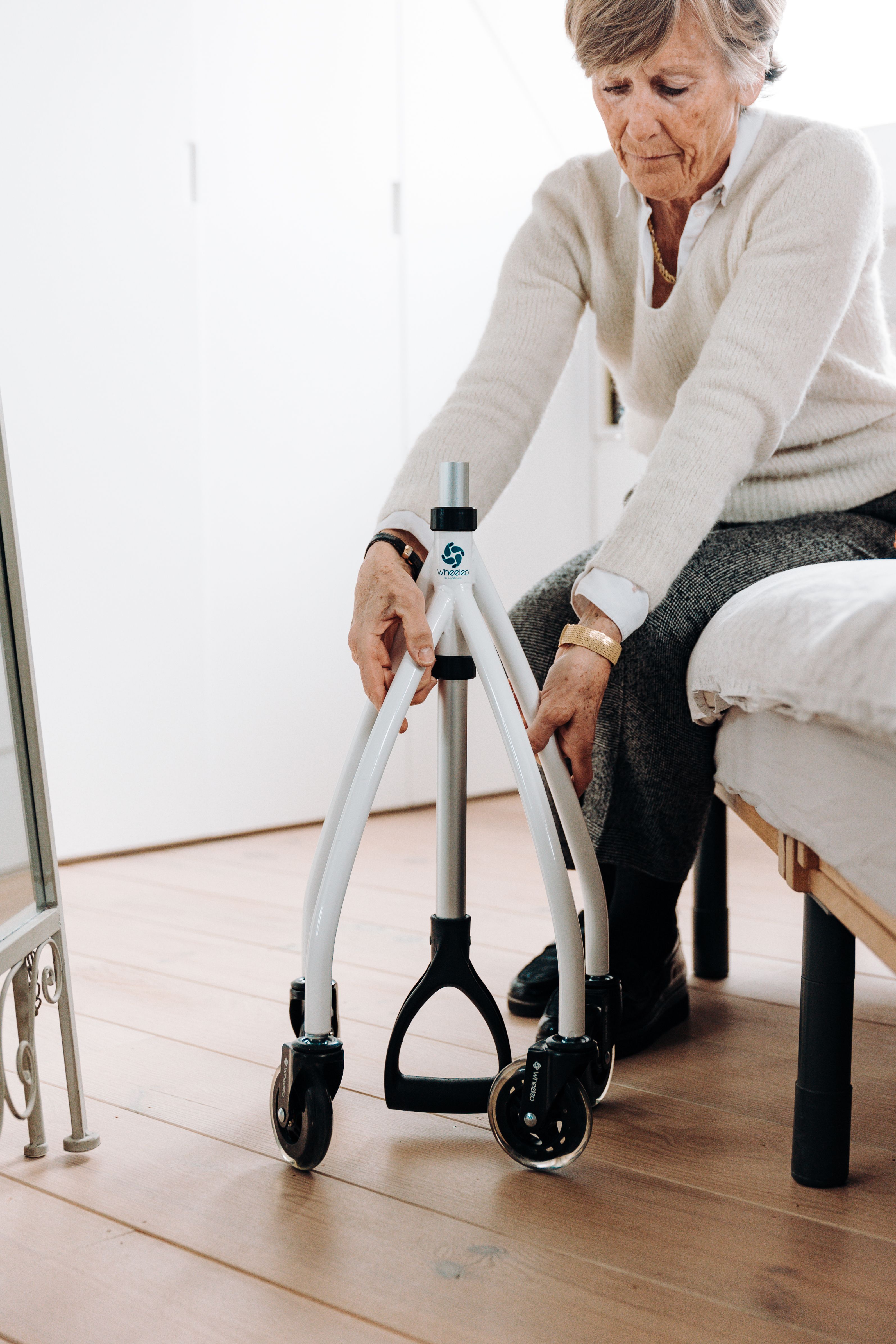 Senior Woman Using Rollator in Cozy Home Setting · Free Stock Photo