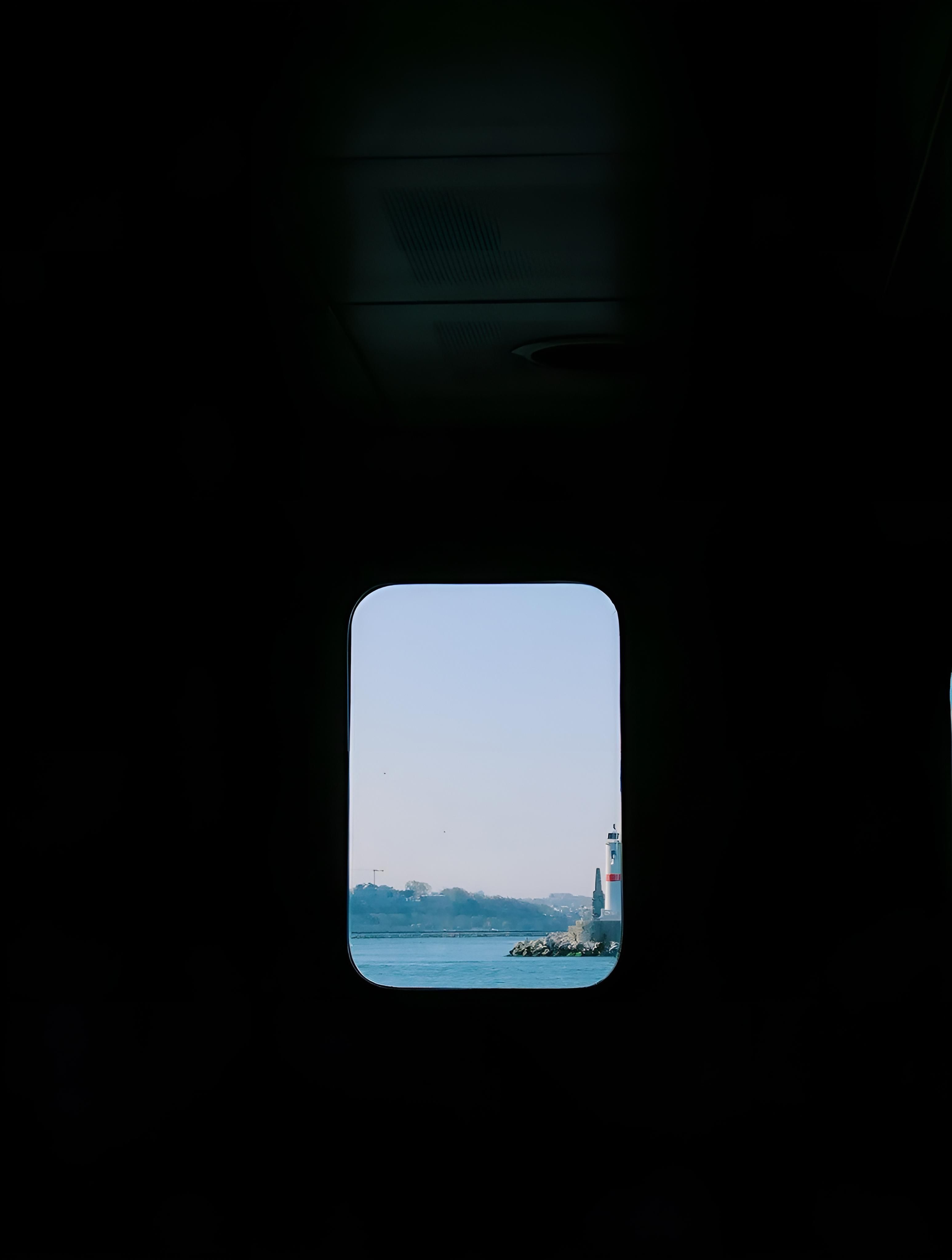 Serene Seascape View Through Boat Window · Free Stock Photo