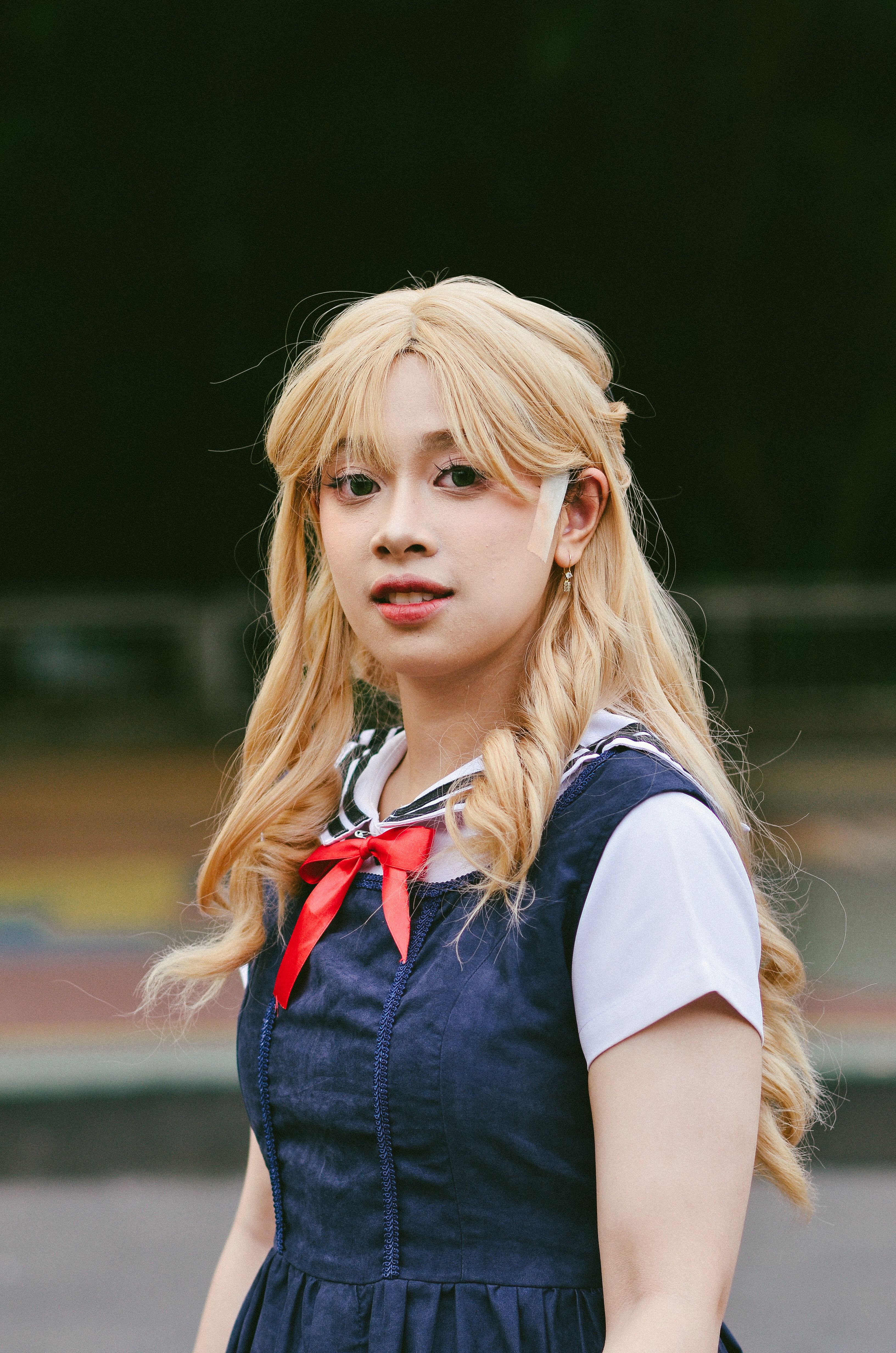 Cosplayer in School Uniform at Outdoor Event · Free Stock Photo