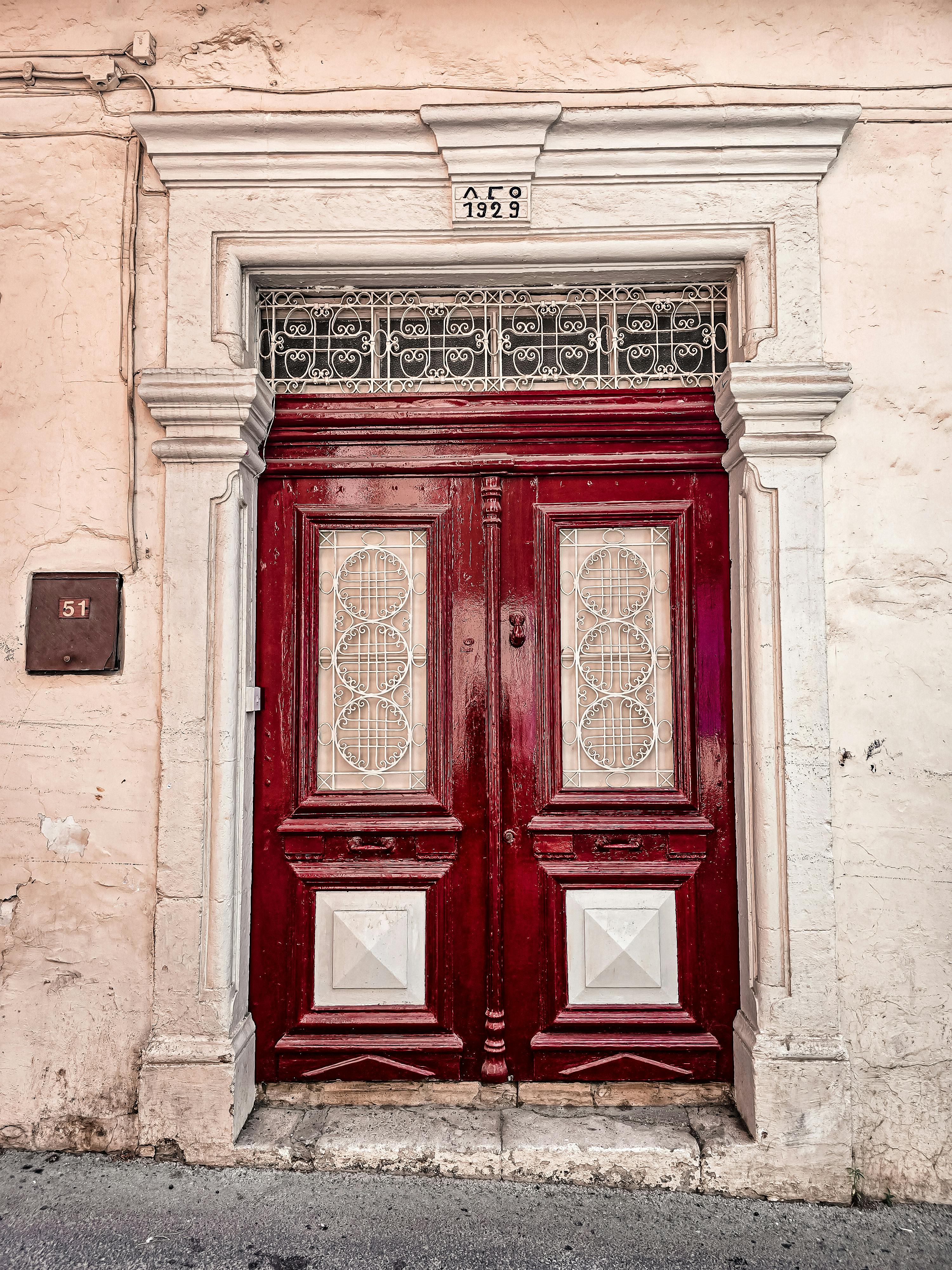 Elegant Vintage Red Door with Intricate Design · Free Stock Photo