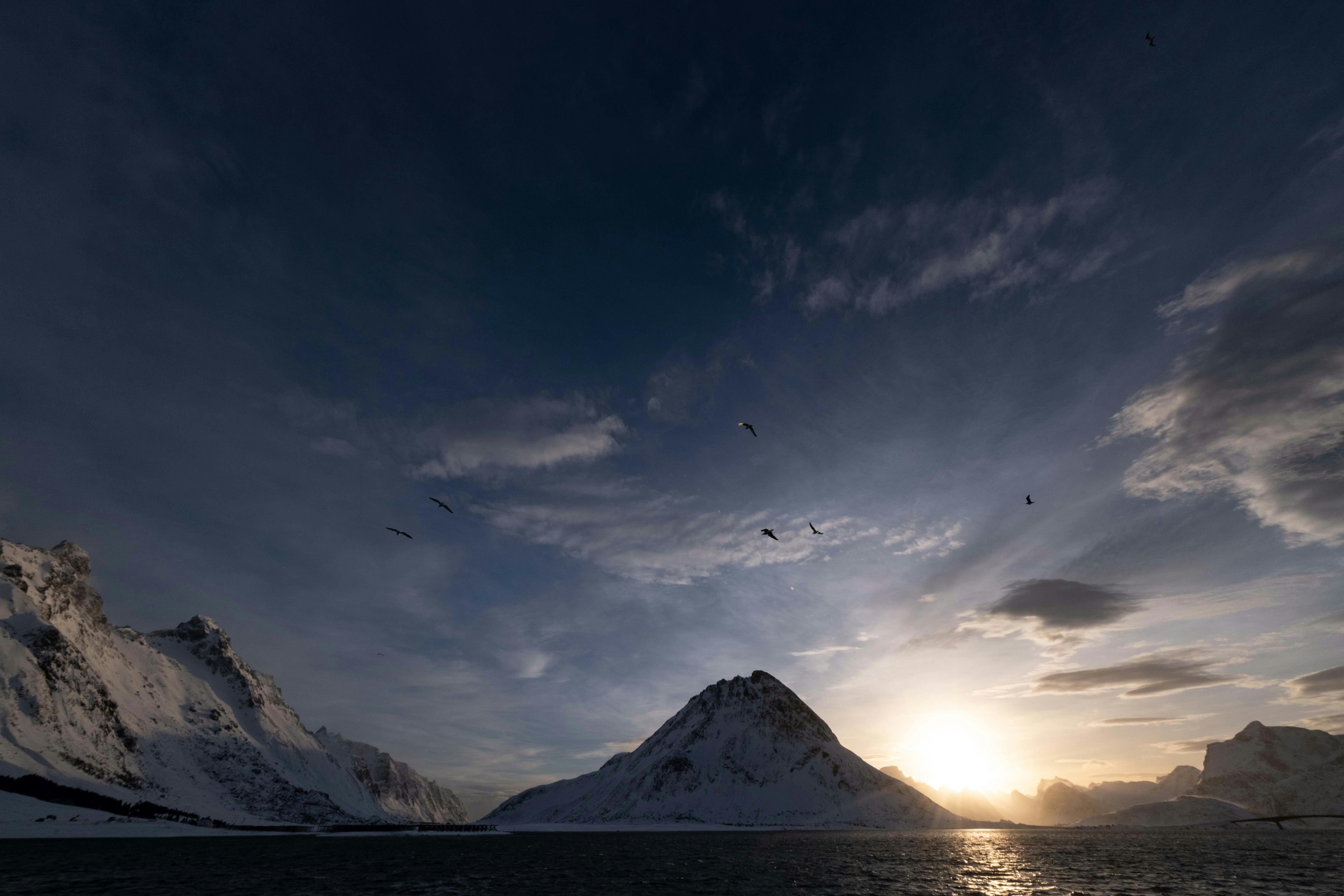 Stunning Arctic Mountain Sunrise Over Snowy Peaks · Free Stock Photo