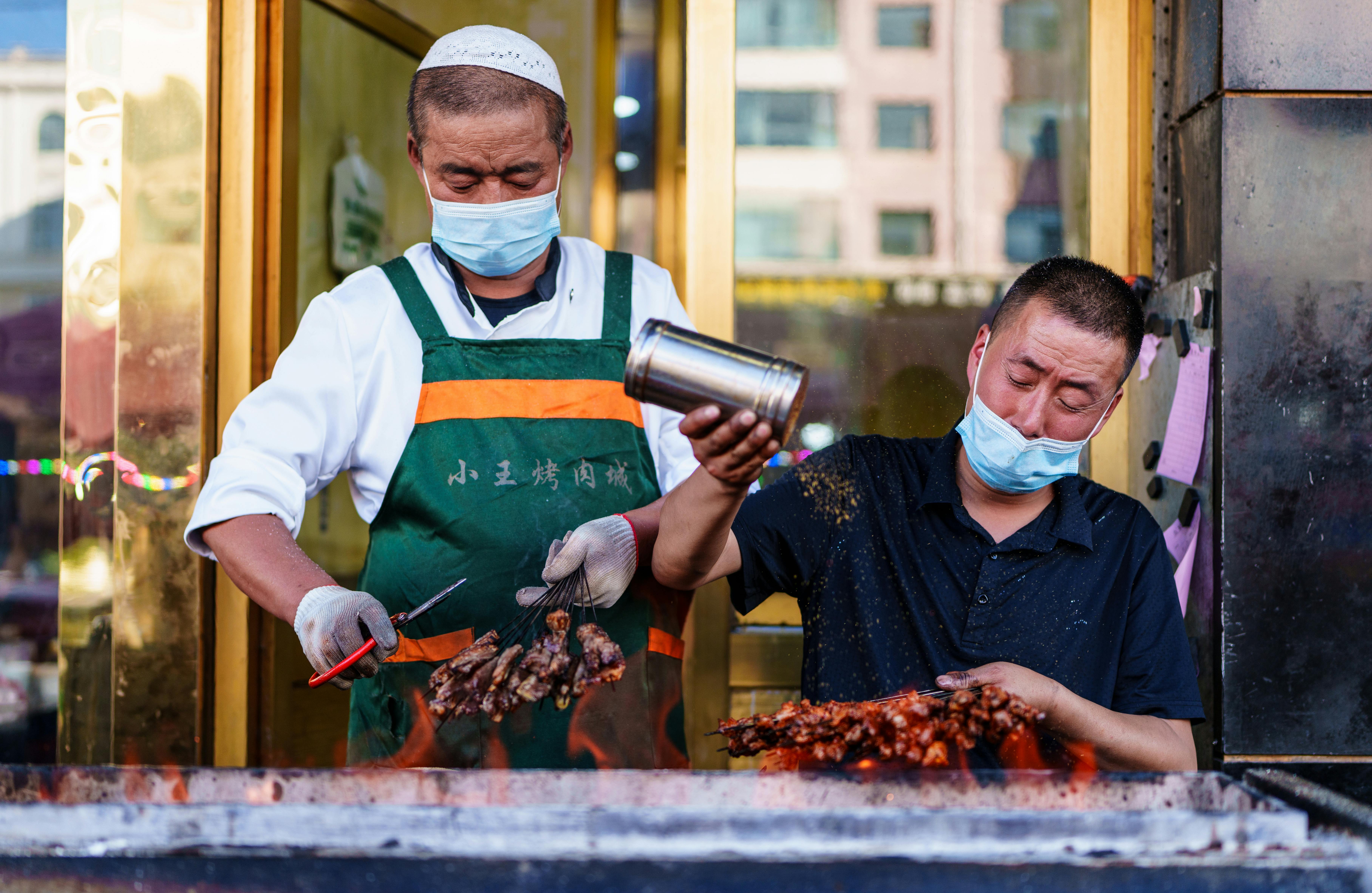 Street Food Vendors Grilling Skewers in Qinghai · Free Stock Photo