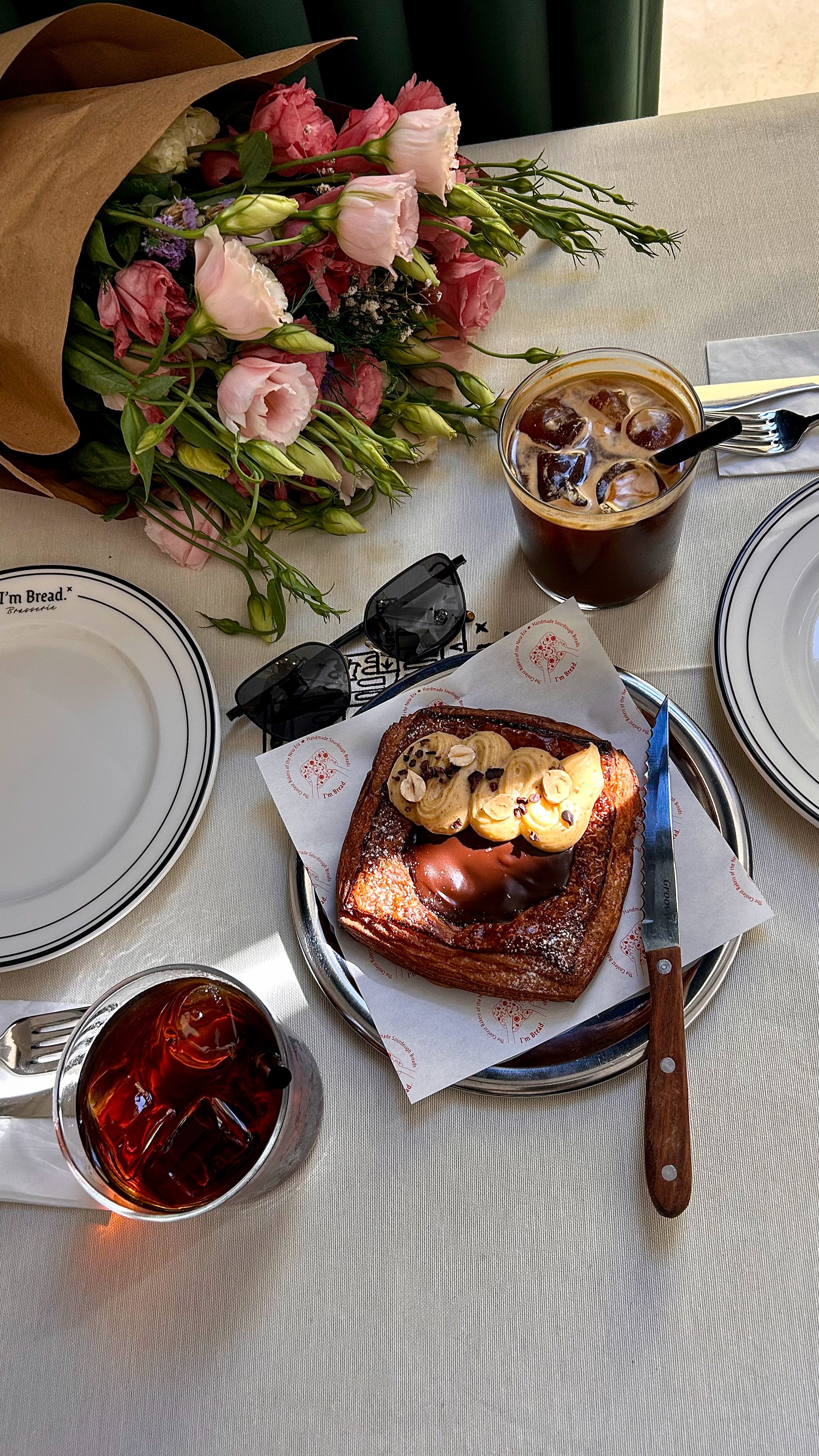 Elegant Brunch Setting with Pastry and Flowers · Free Stock Photo