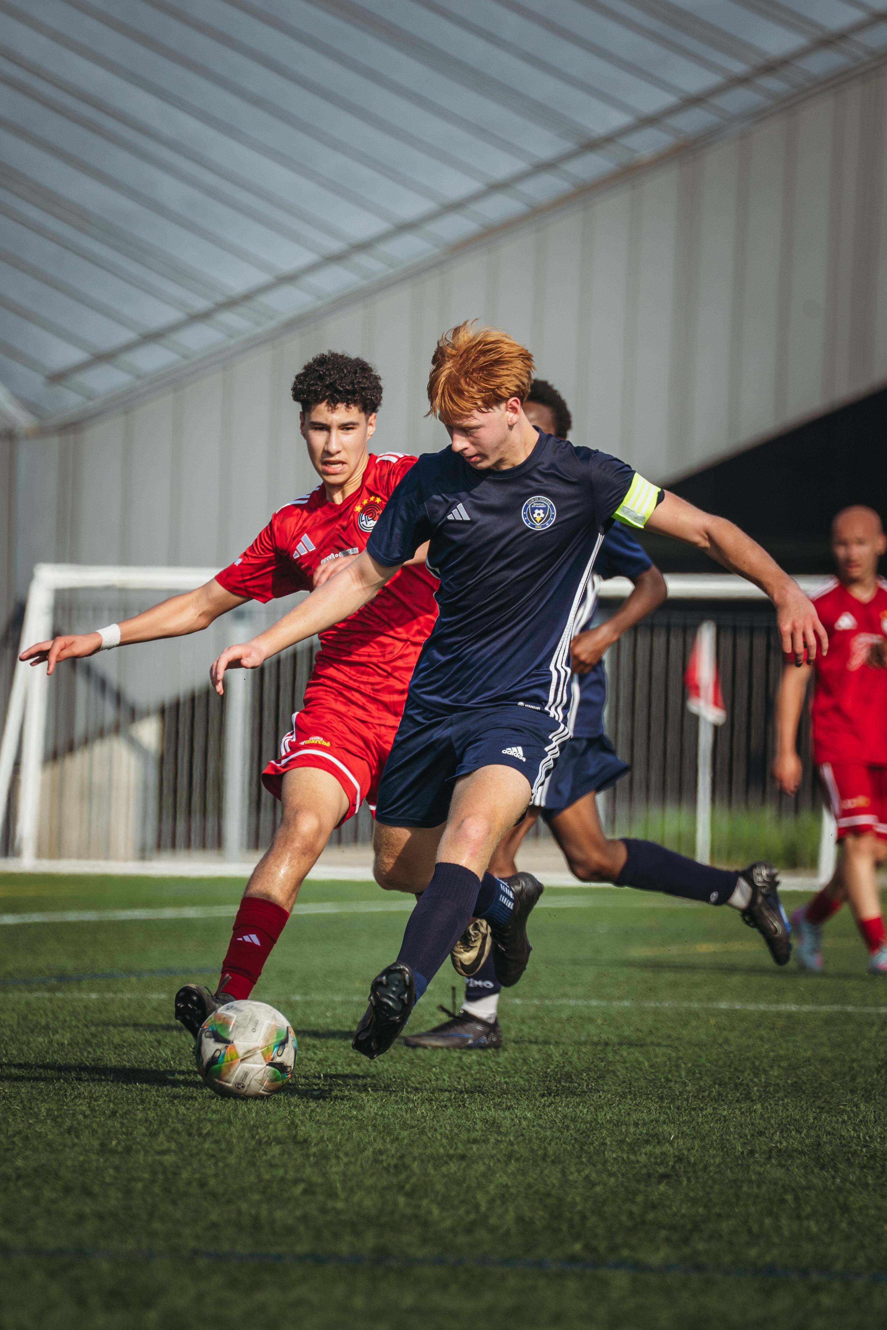 Intense Soccer Match on Outdoor Field · Free Stock Photo