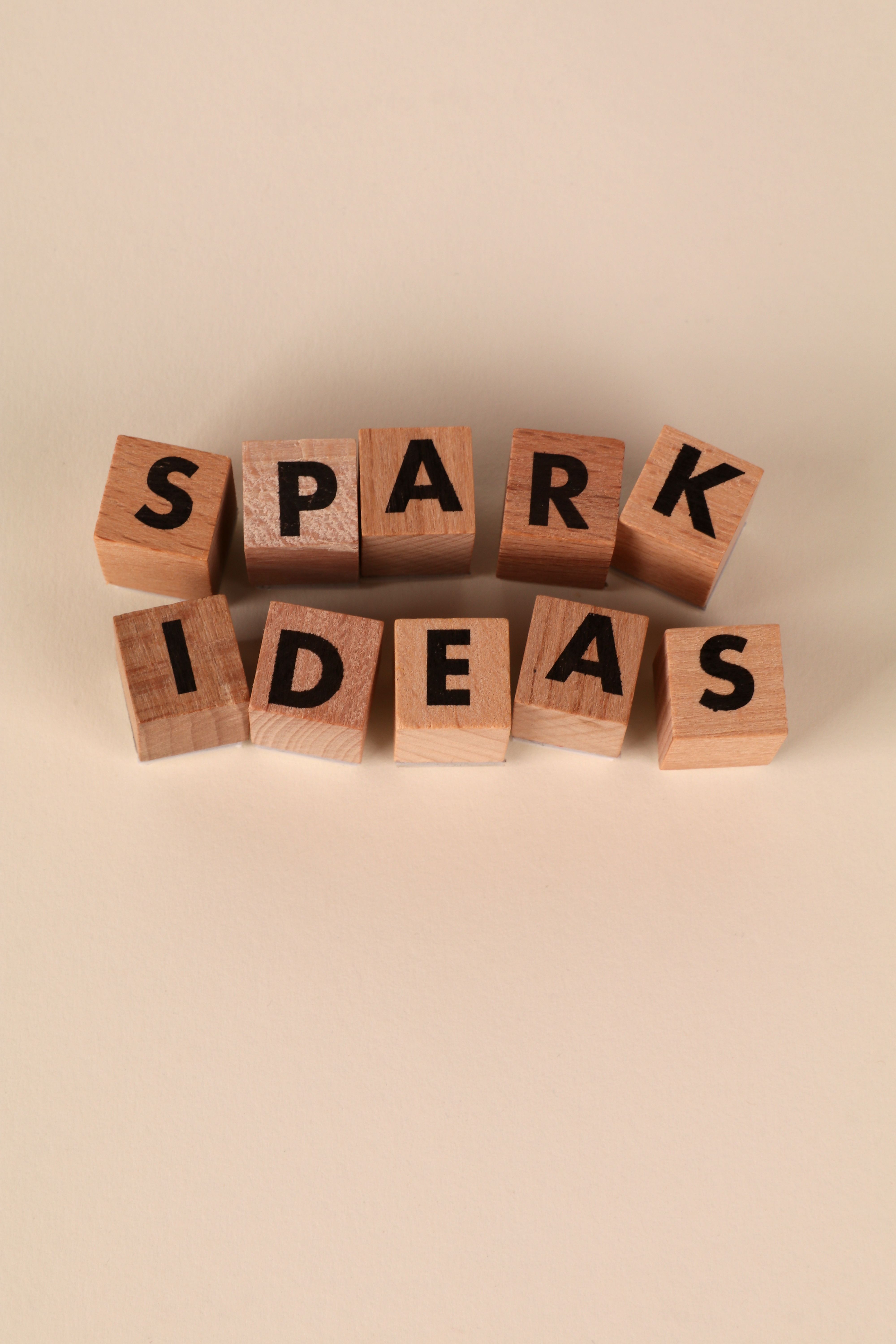 Creative Spark Idea Wooden Blocks on Beige · Free Stock Photo