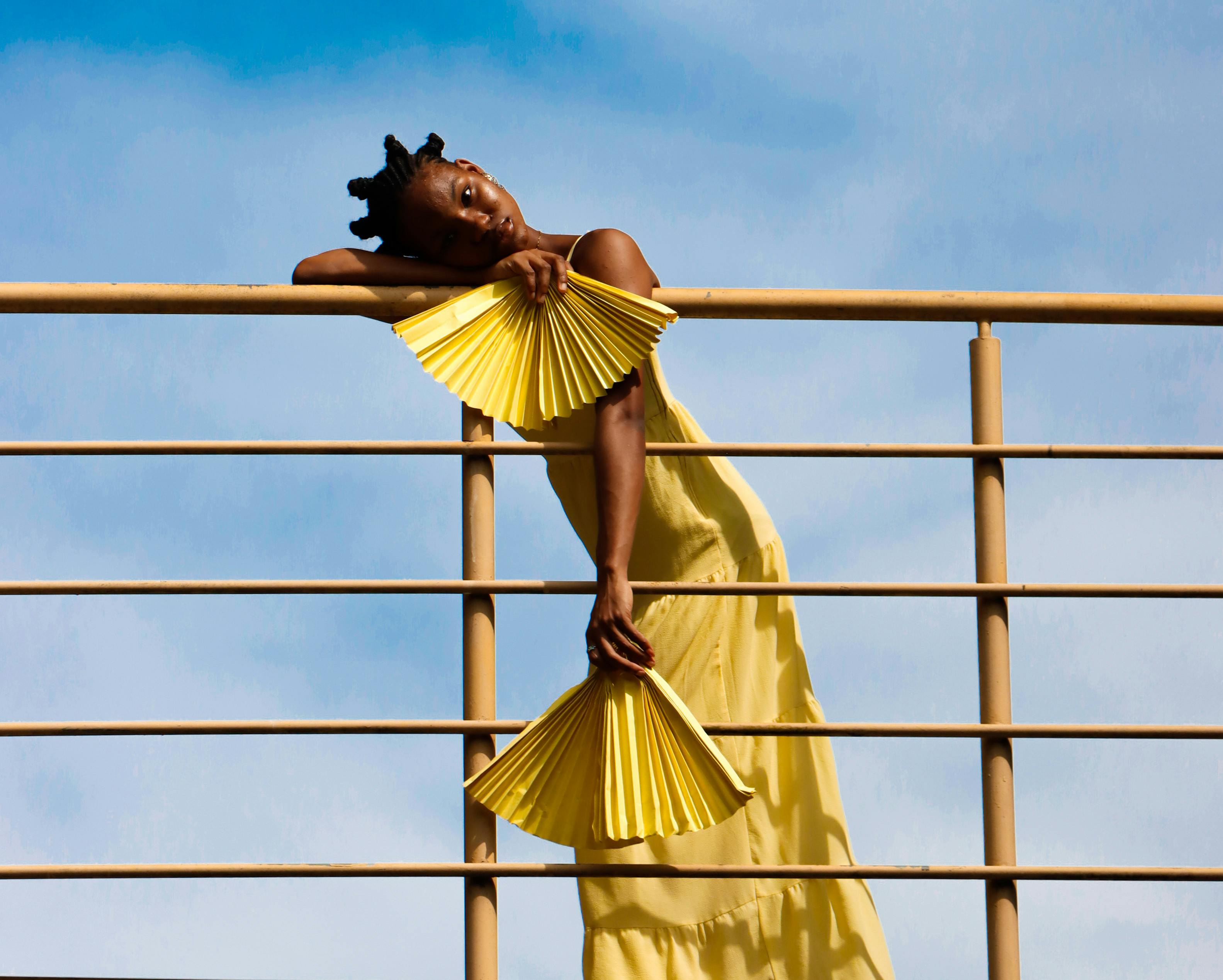 Elegant Fashion Portrait with Yellow Fans · Free Stock Photo