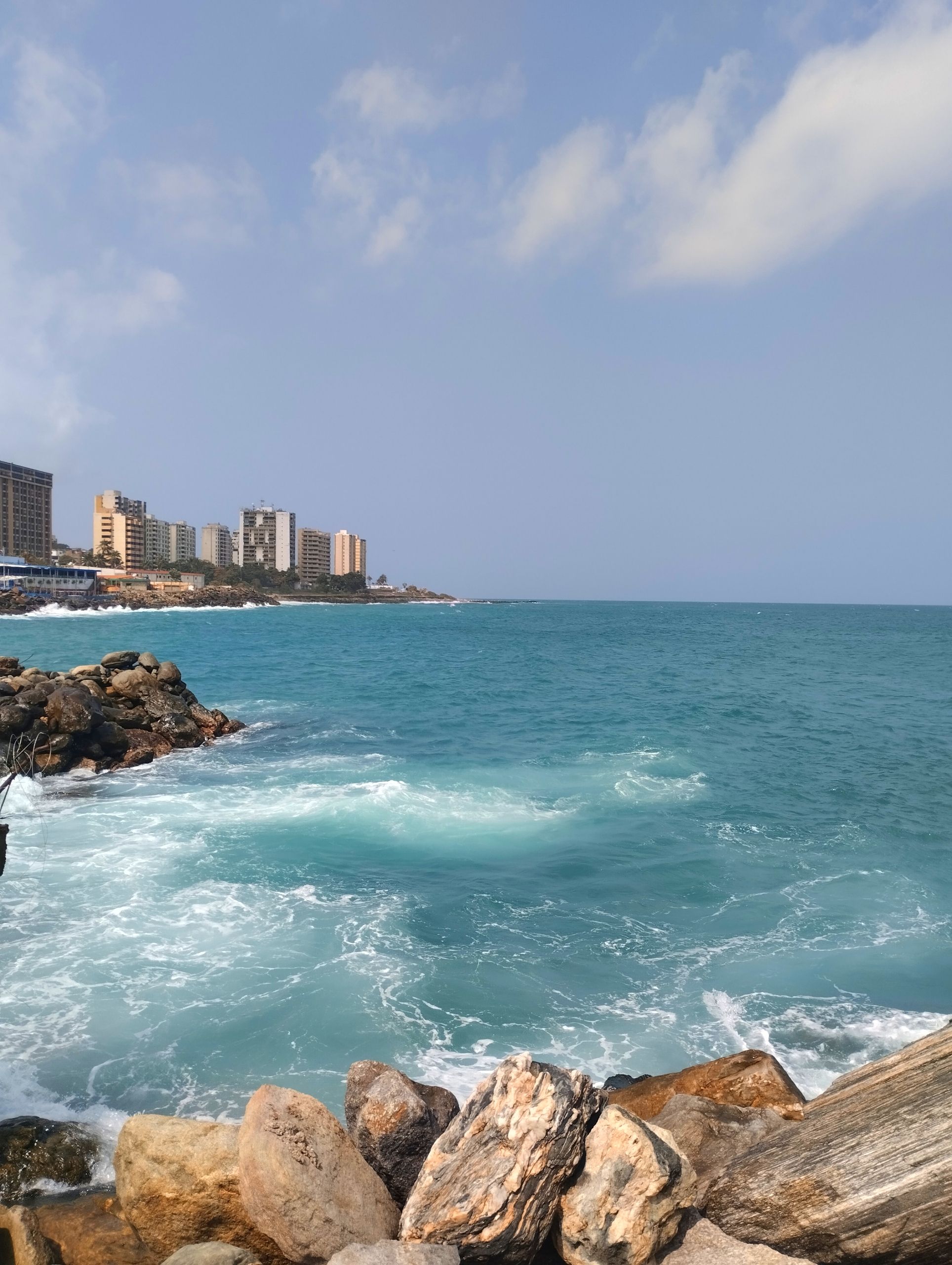 Vibrant Coastal Cityscape and Turquoise Sea · Free Stock Photo