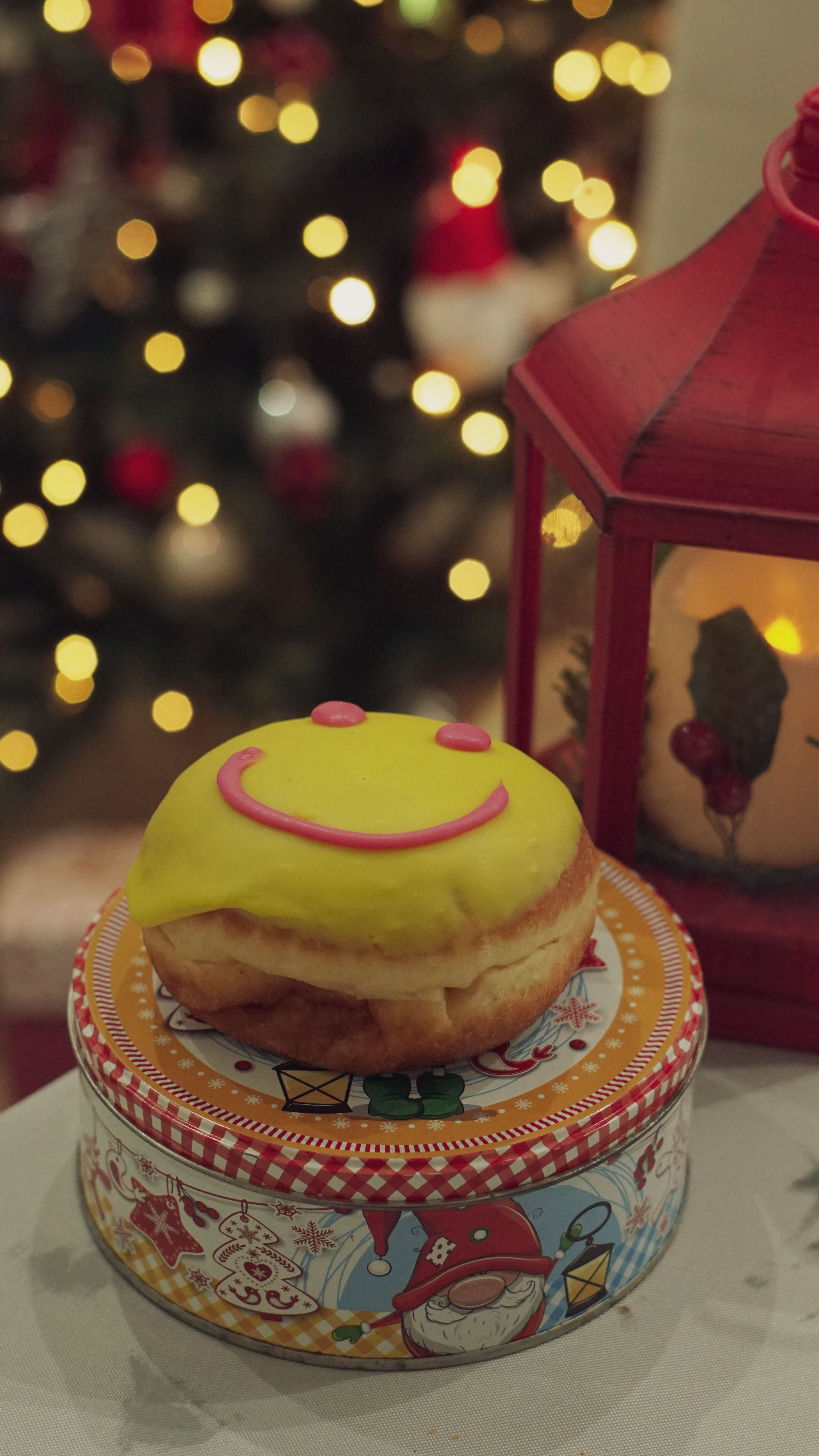 Festive Smiley Face Donut with Christmas Decor · Free Stock Photo