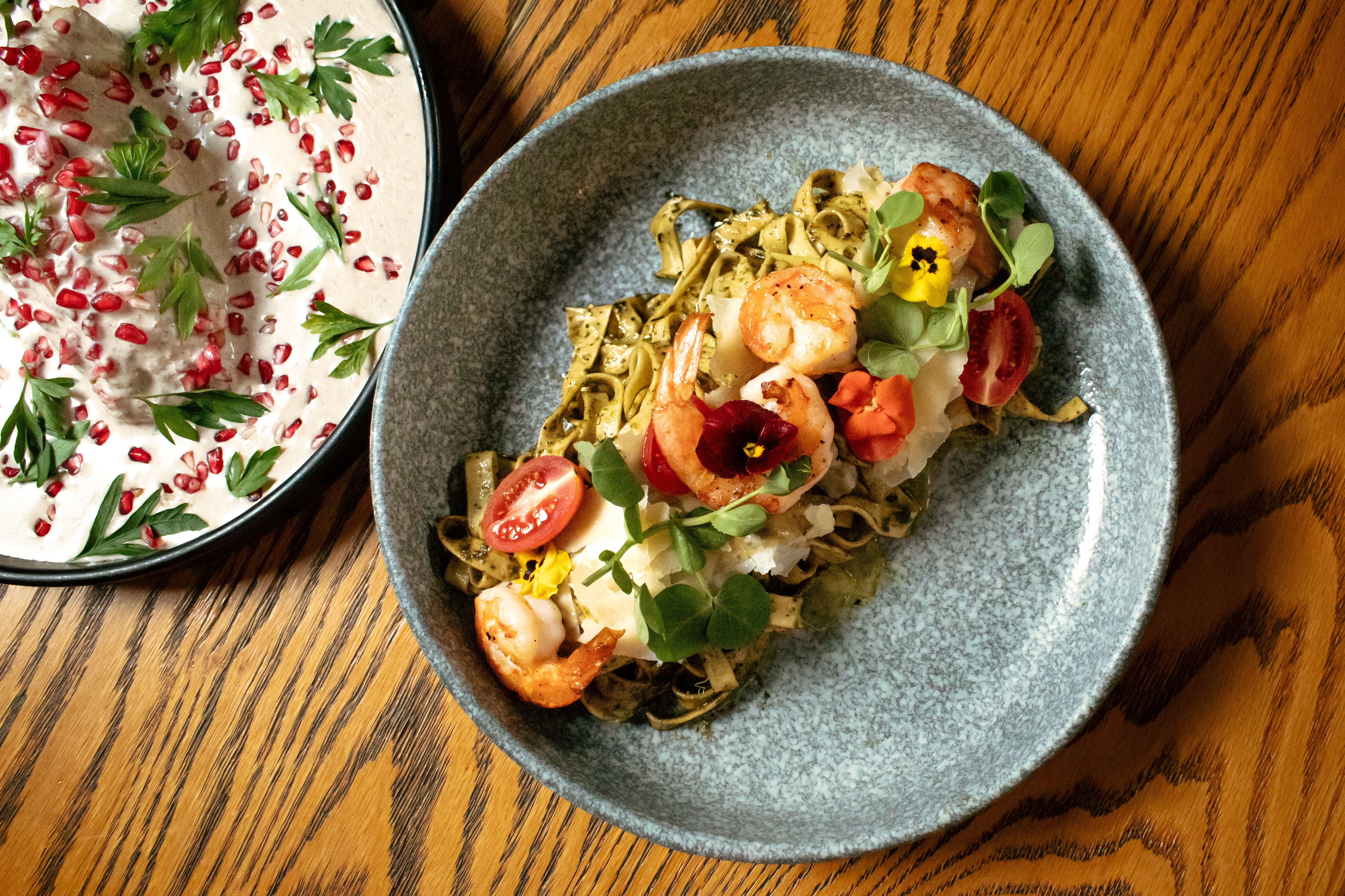 Gourmet Pasta Dish with Shrimp and Edible Flowers · Free Stock Photo
