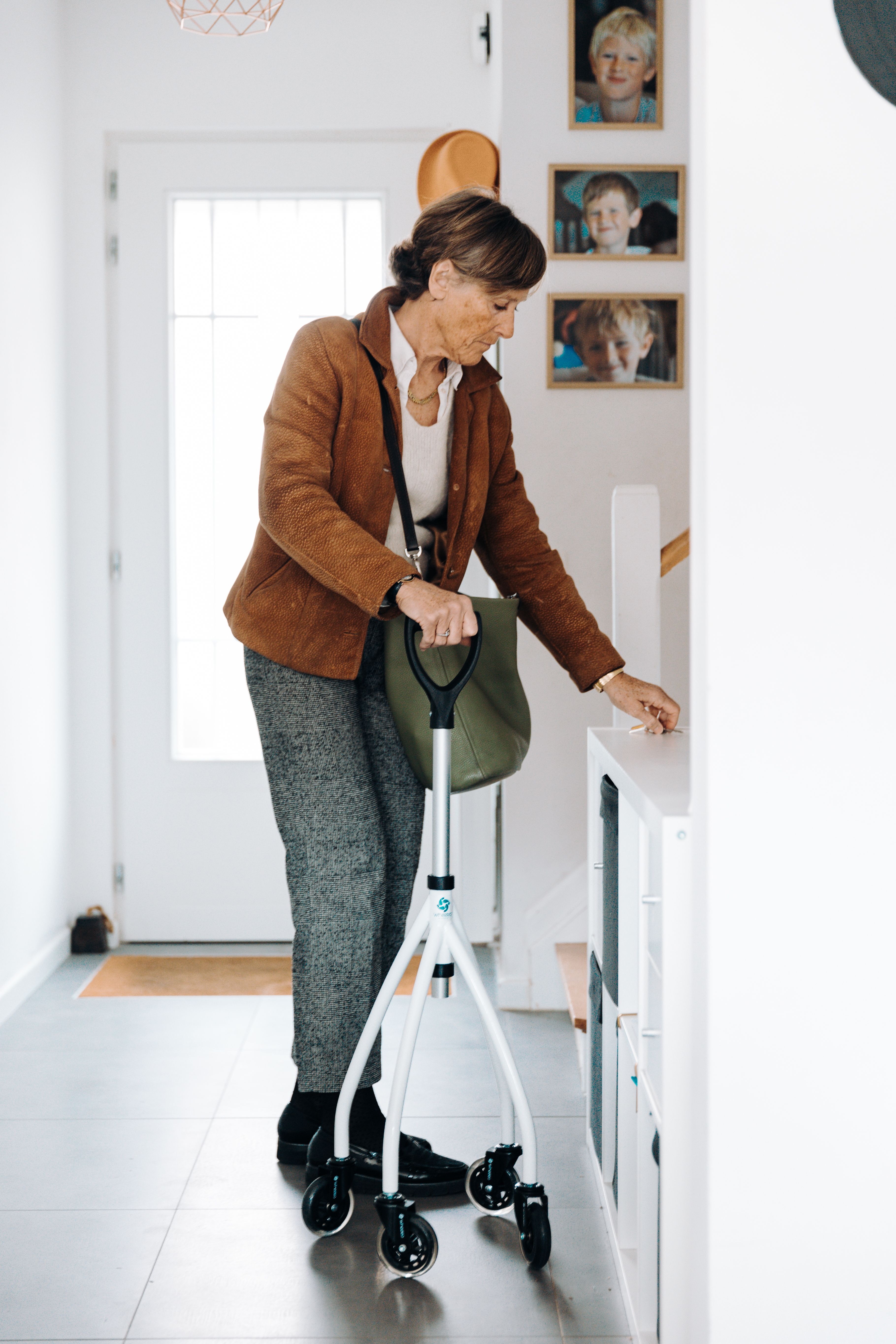 Senior Woman Using Rollator in Home Setting · Free Stock Photo