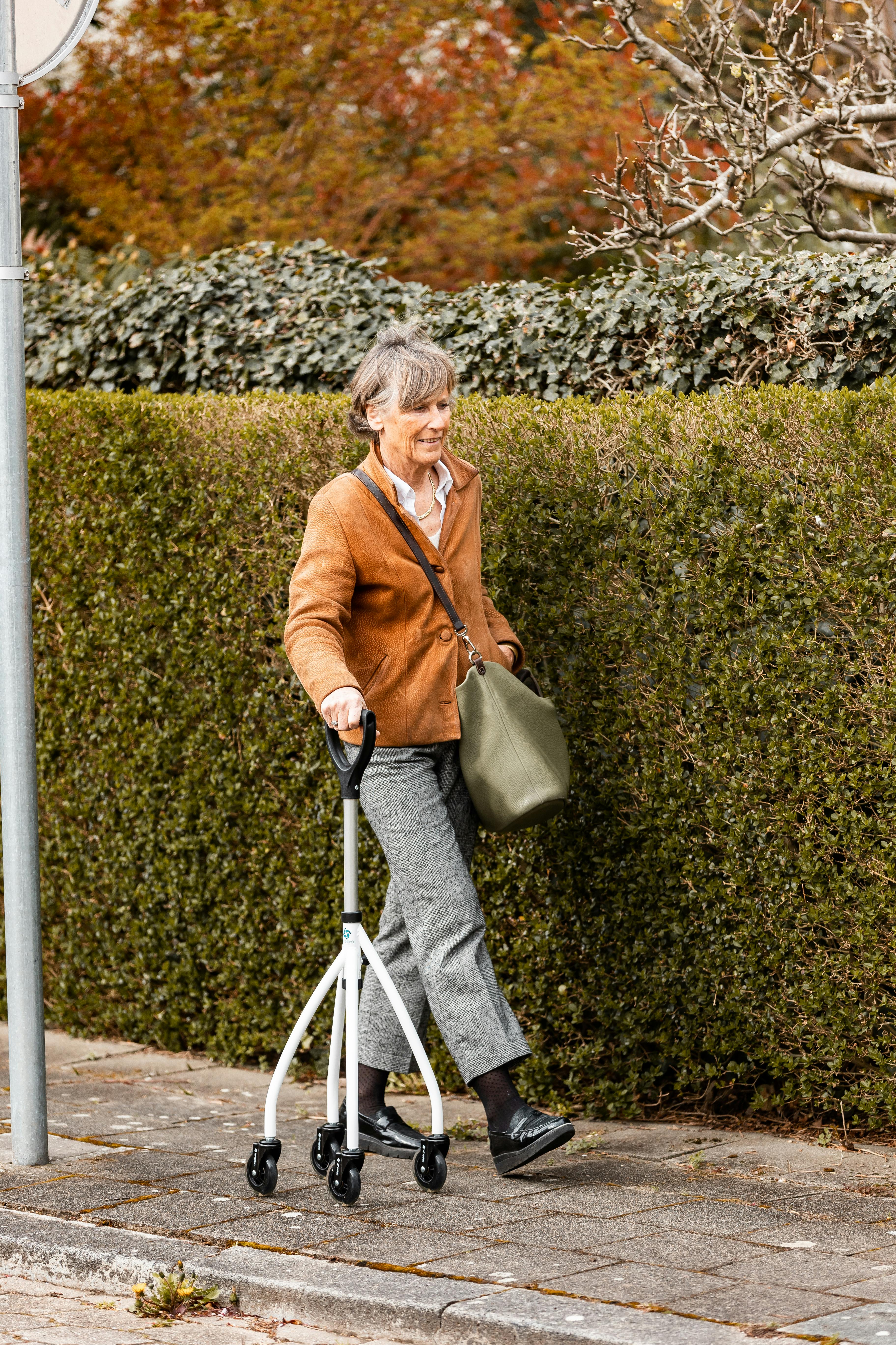 Senior Woman Walking with Modern Walker · Free Stock Photo
