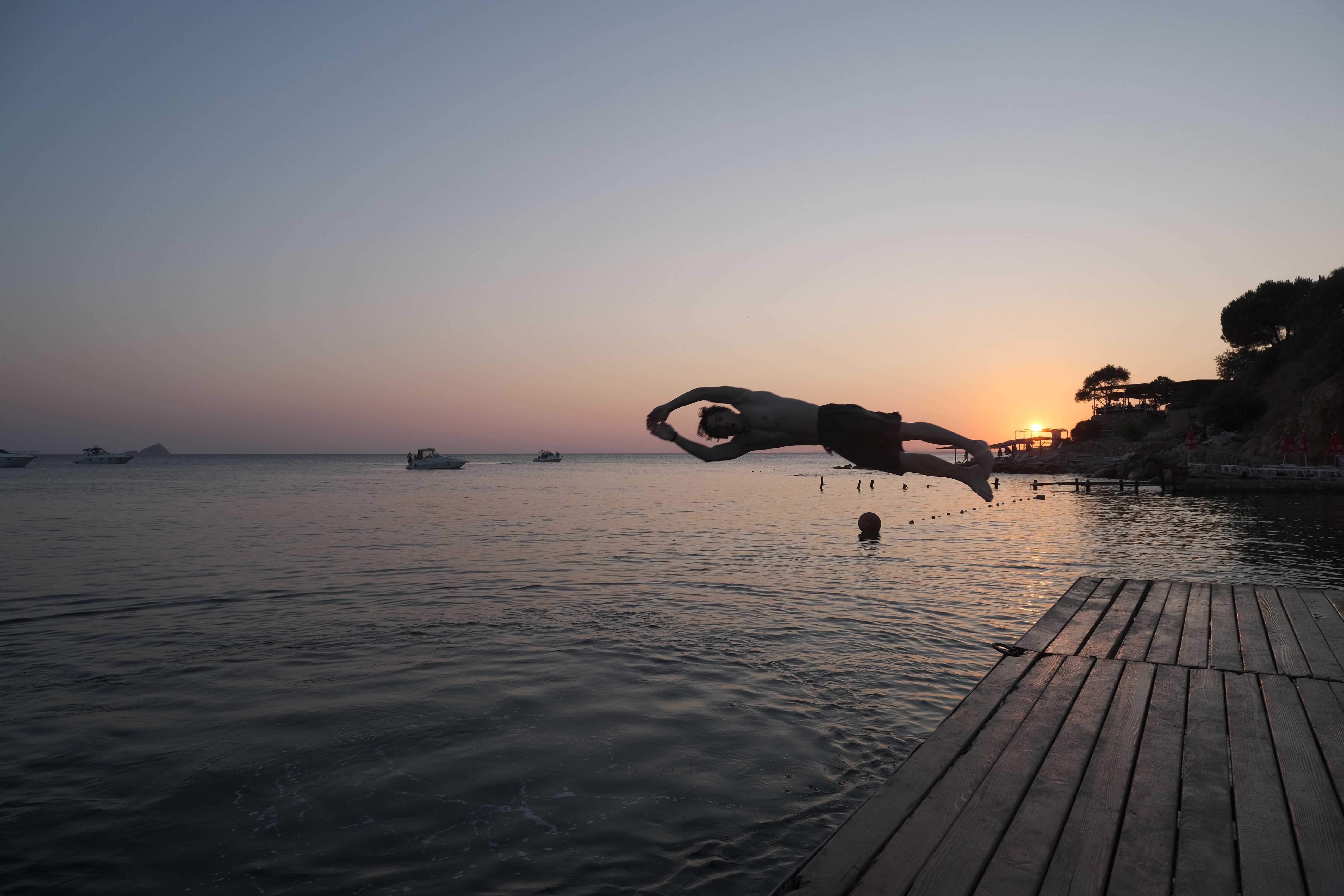 Sunset Dive into Marmara Sea from Istanbul Jetty · Free Stock Photo