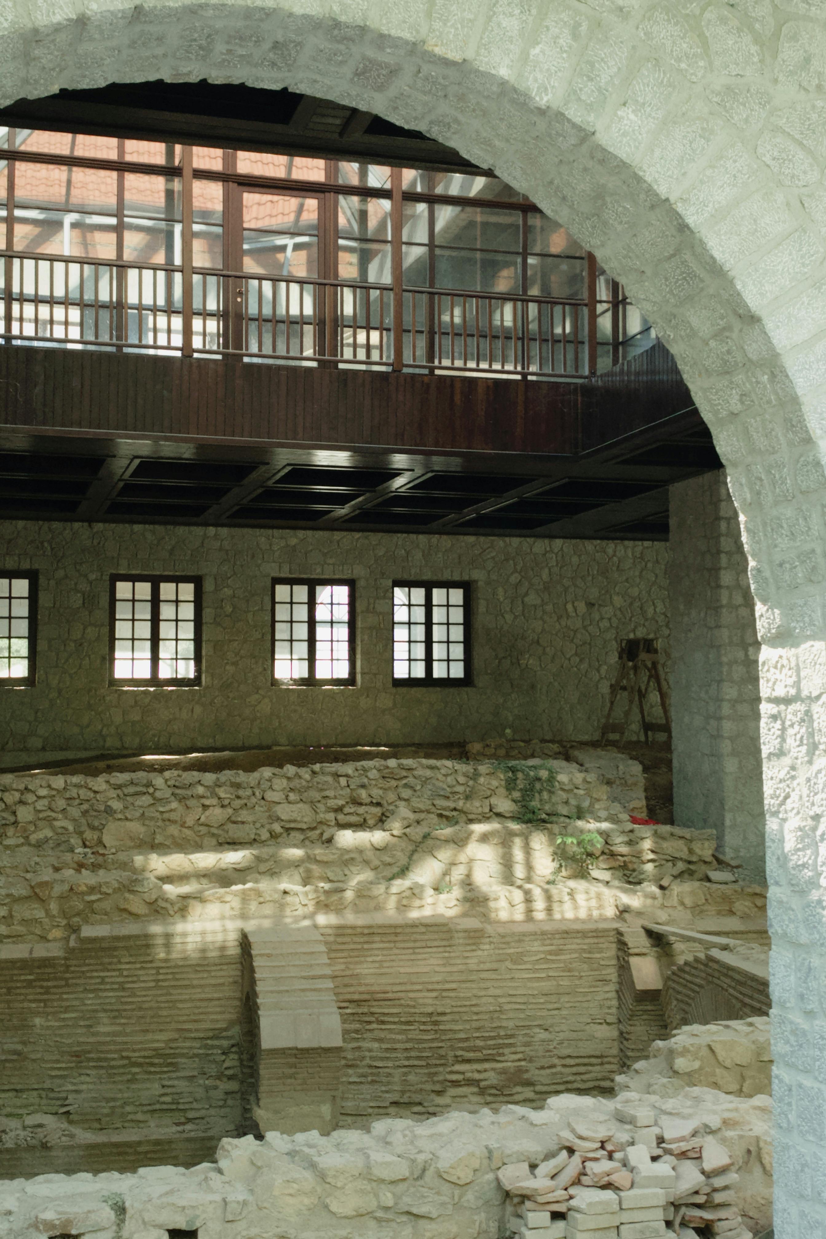 Ancient Ruins Inside Modern Stone Structure · Free Stock Photo