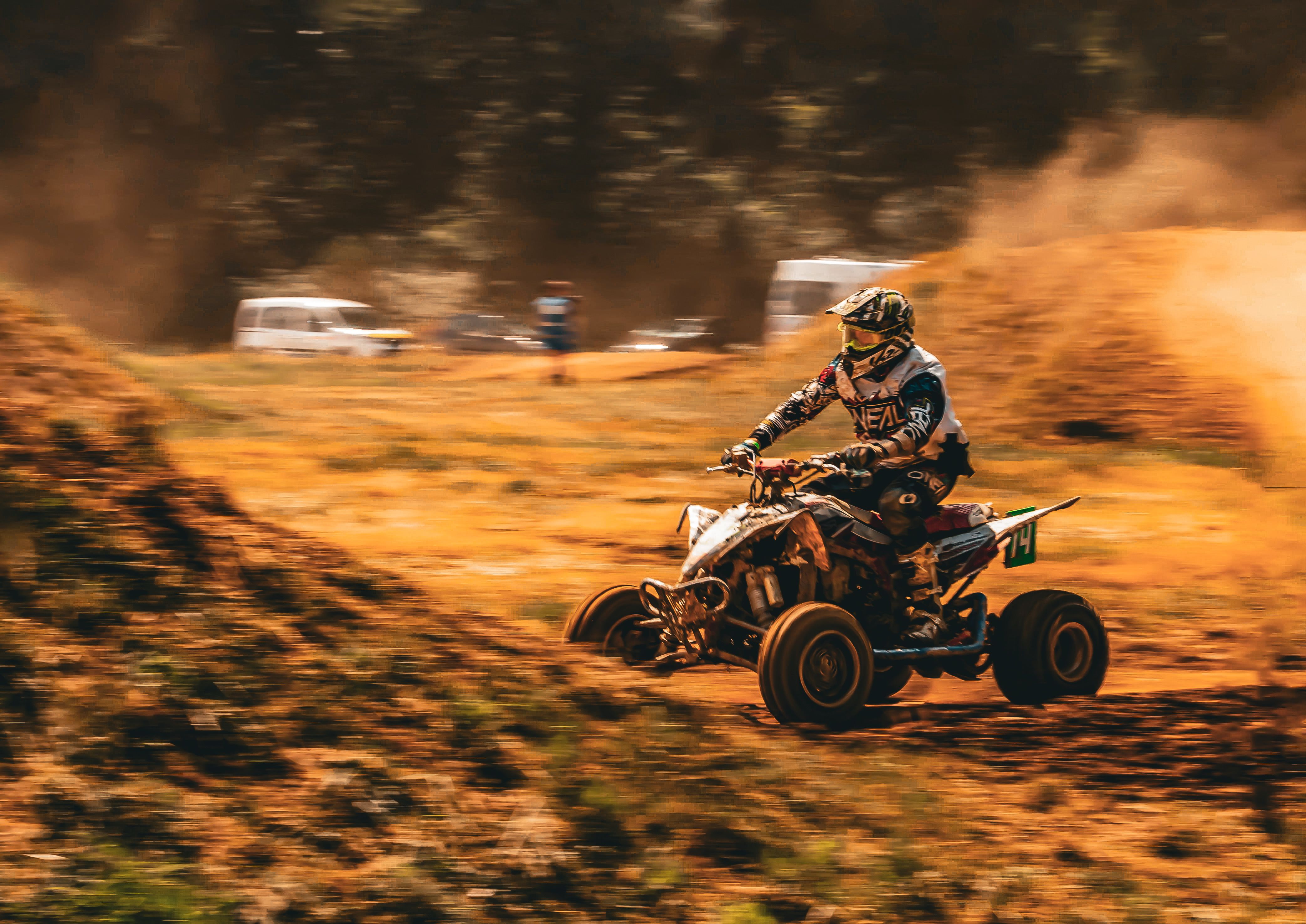 Dynamic Quad Bike Racing in Outdoor Terrain · Free Stock Photo
