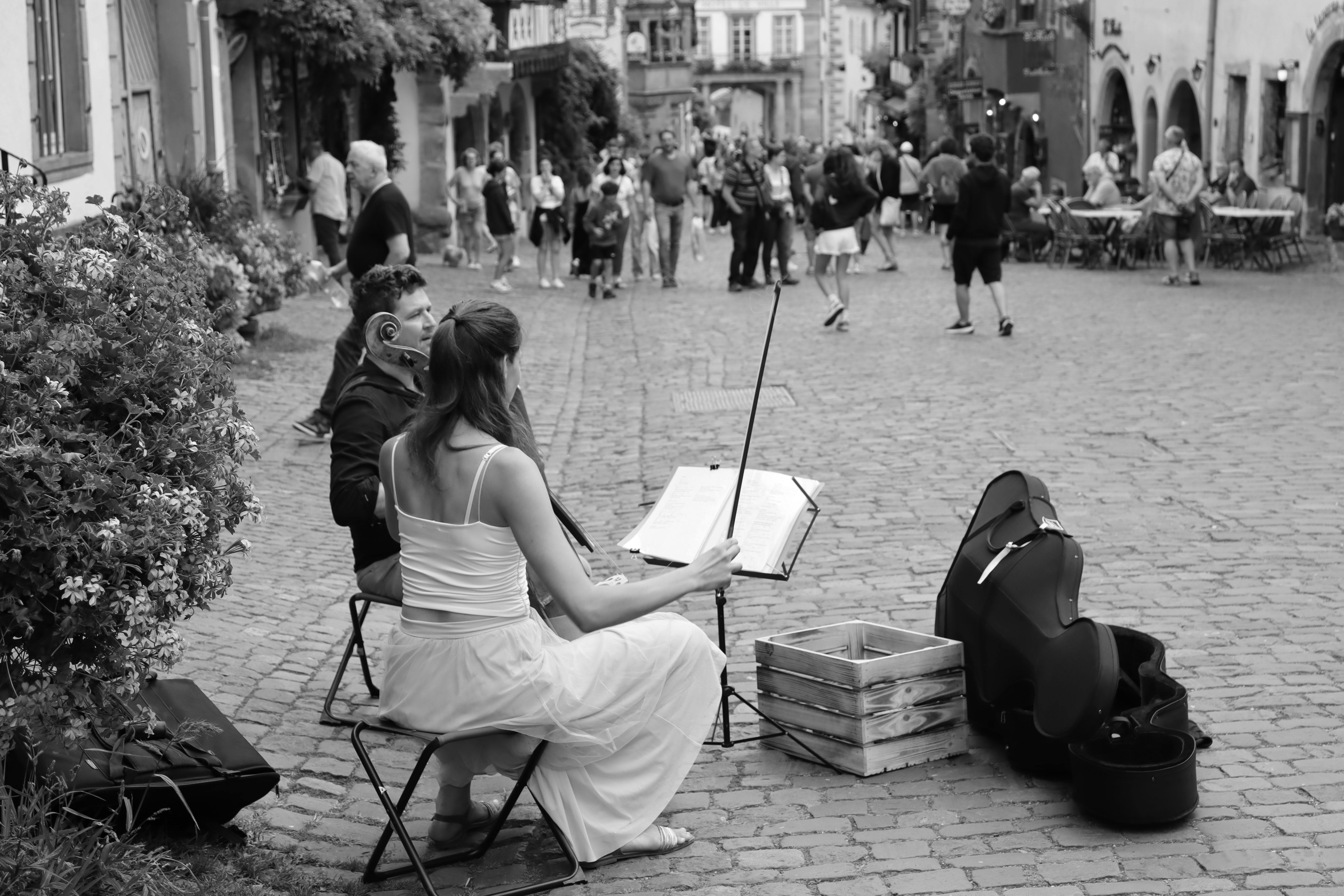 Street Musicians Performing in a European Town · Free Stock Photo