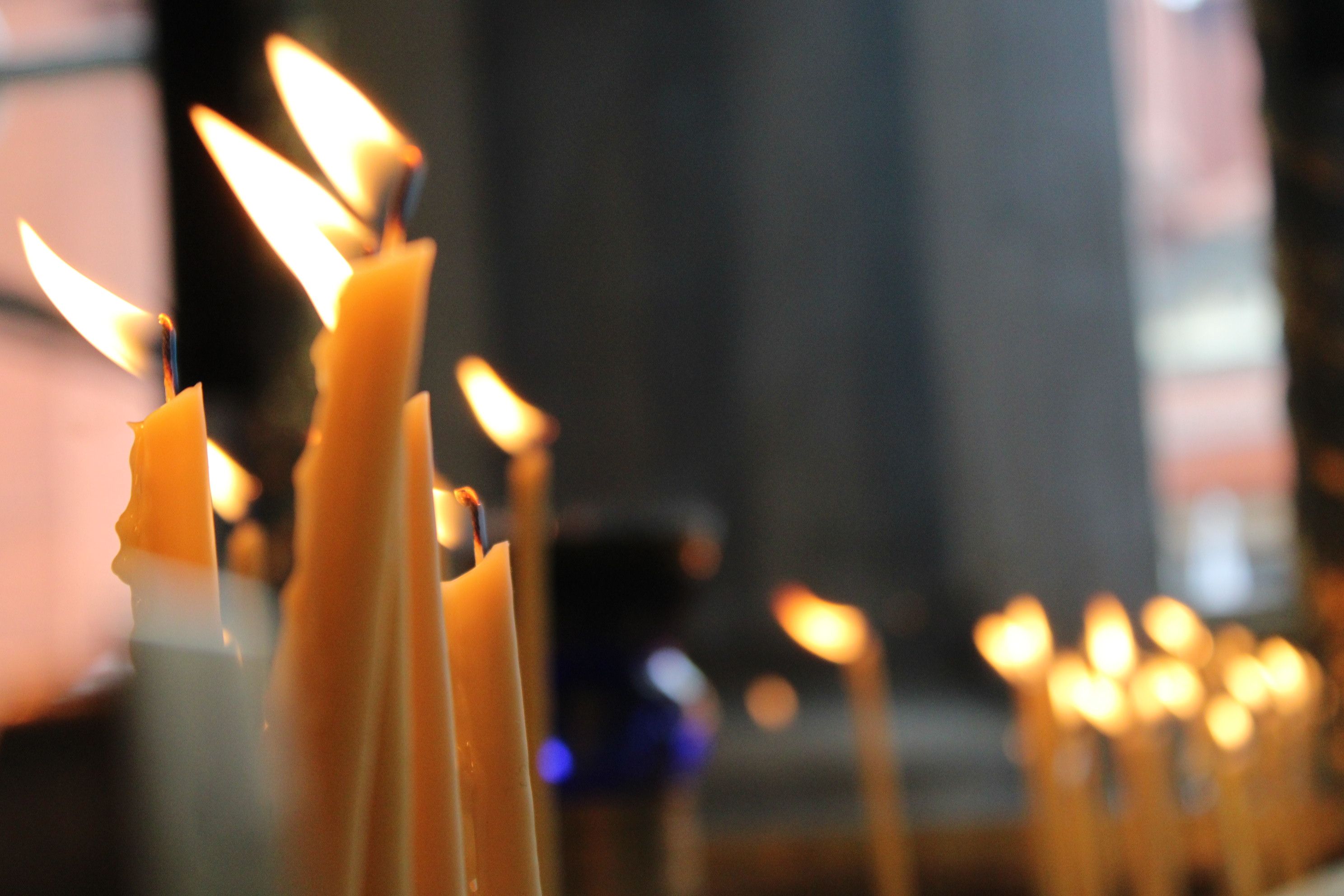 Warm Glow of Candlelight in Dimly Lit Setting · Free Stock Photo