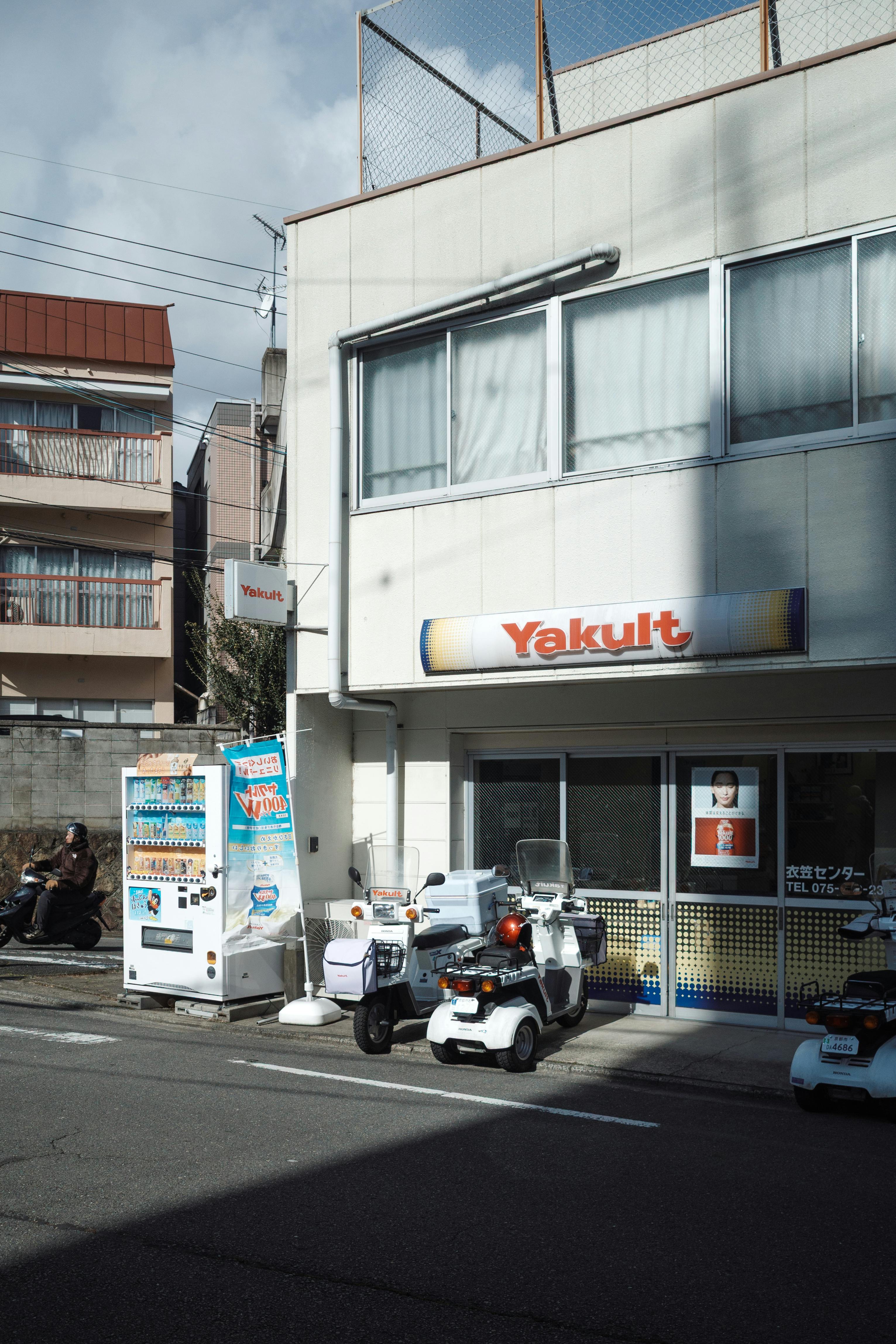 Japanese Street Scene with Yakult Storefront · Free Stock Photo