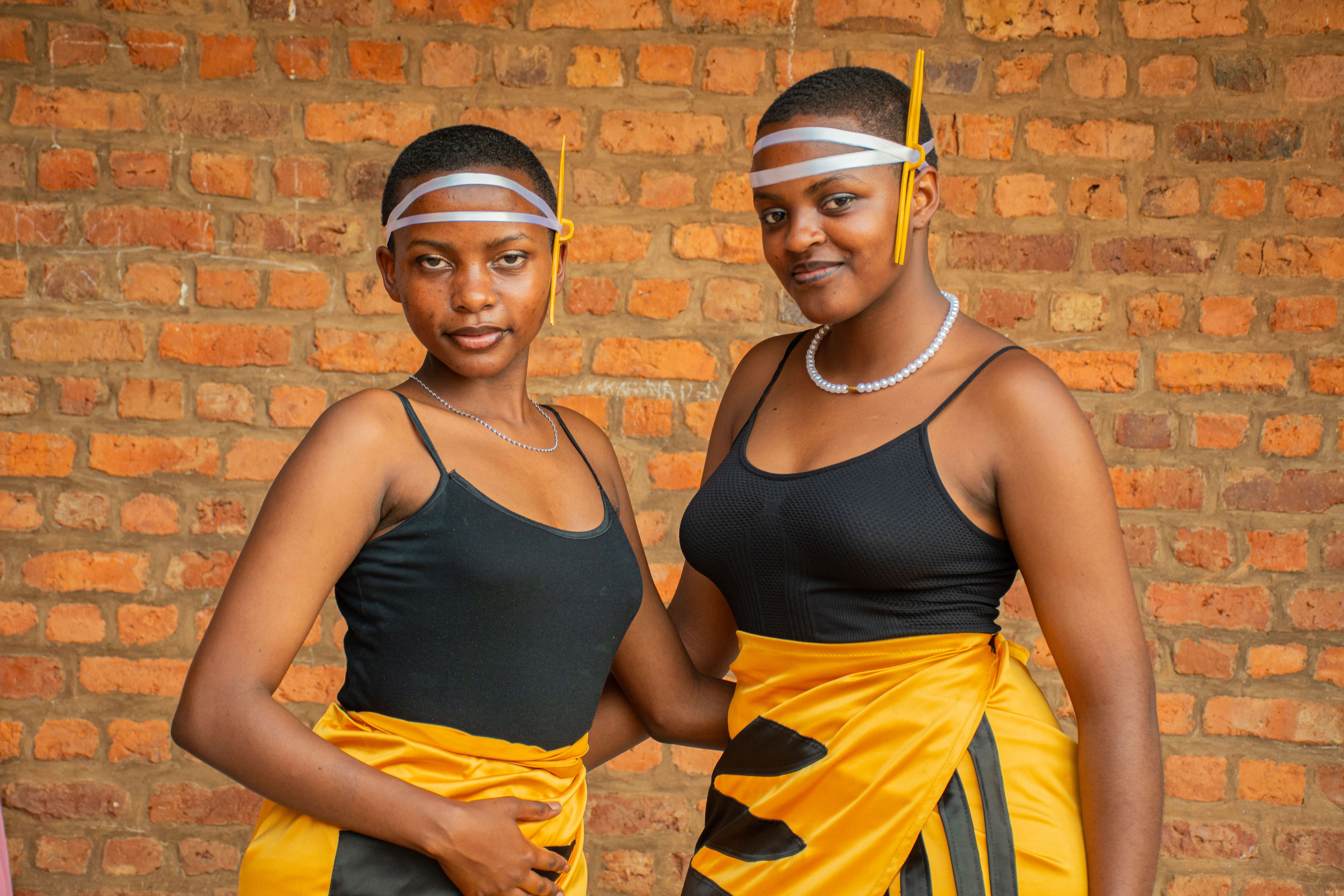 Traditional Dance Attire with Brick Wall Background · Free Stock Photo