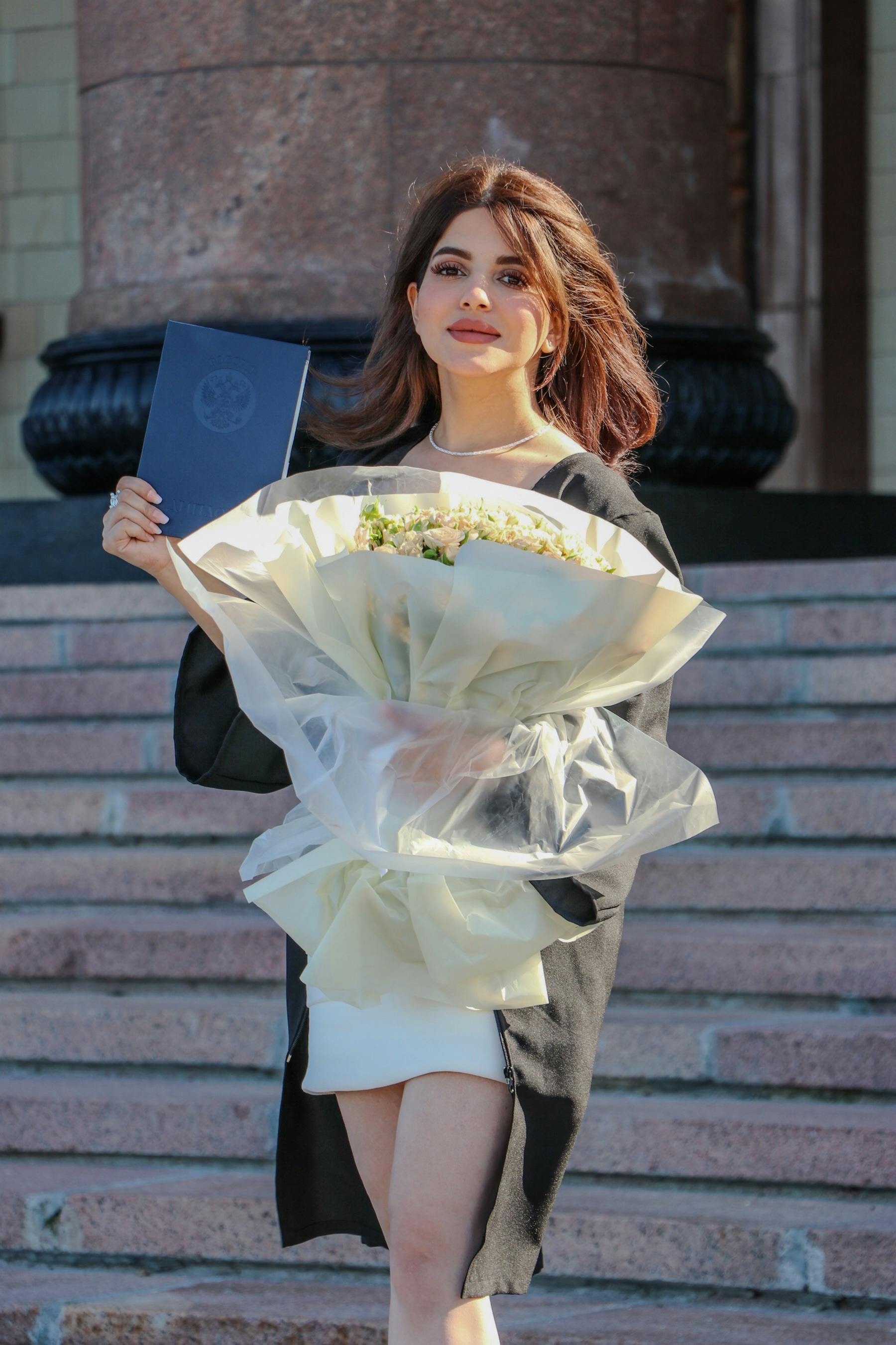 Female Graduate Holding Diploma and Flowers on Graduation Day · Free ...