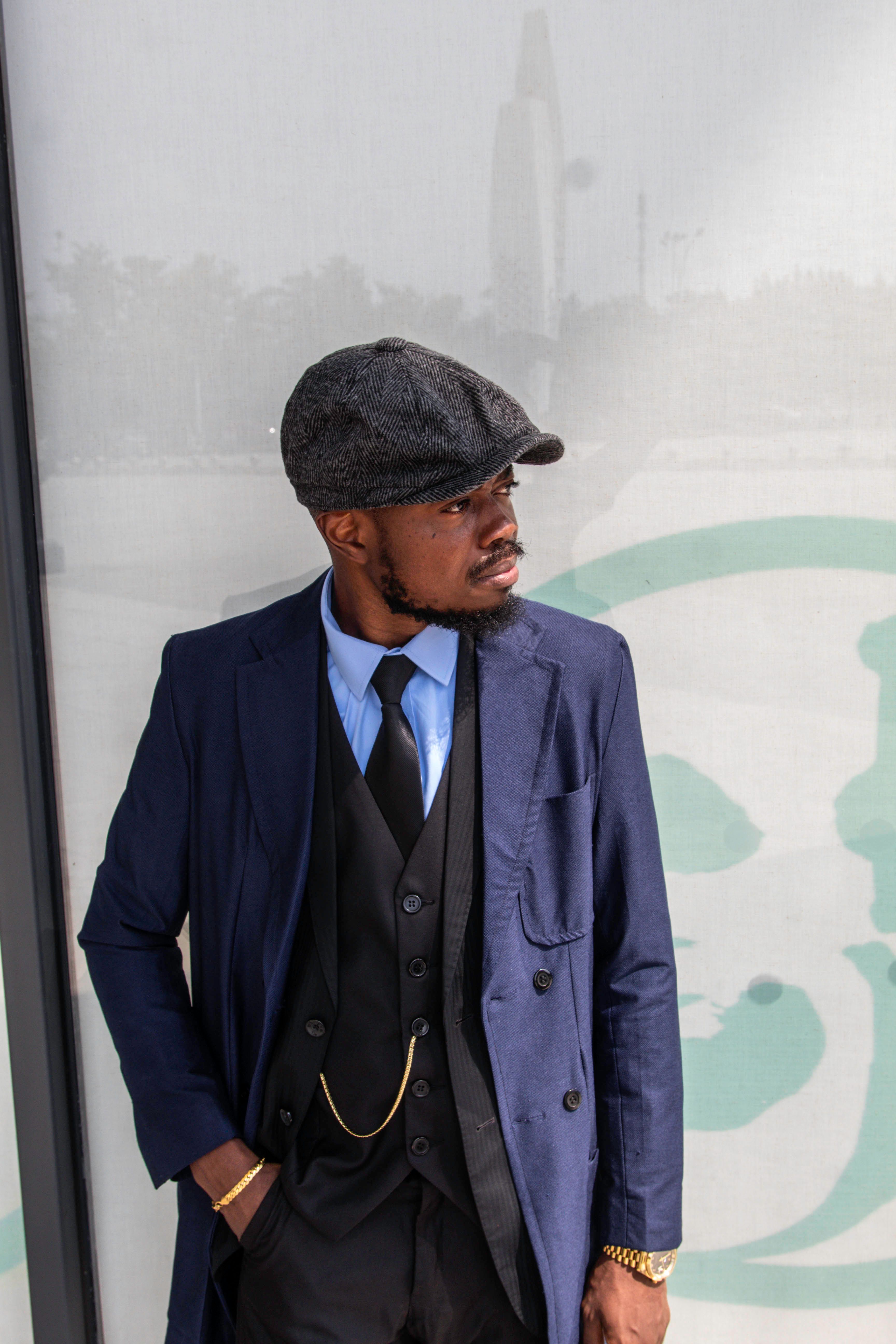 Stylish Man in Vintage Suit with Flat Cap · Free Stock Photo