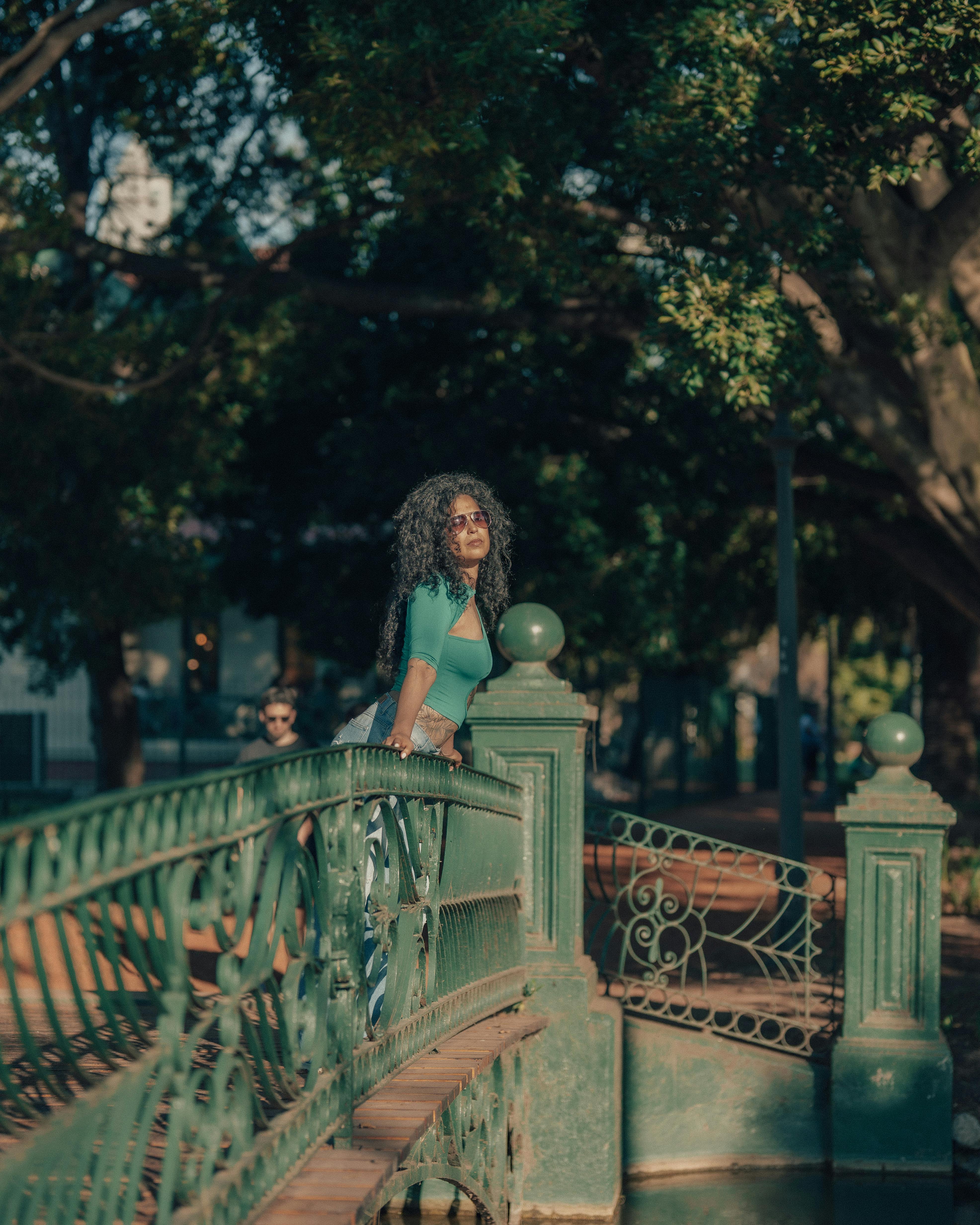 Chic Woman Posing on Ornate Bridge in Buenos Aires · Free Stock Photo
