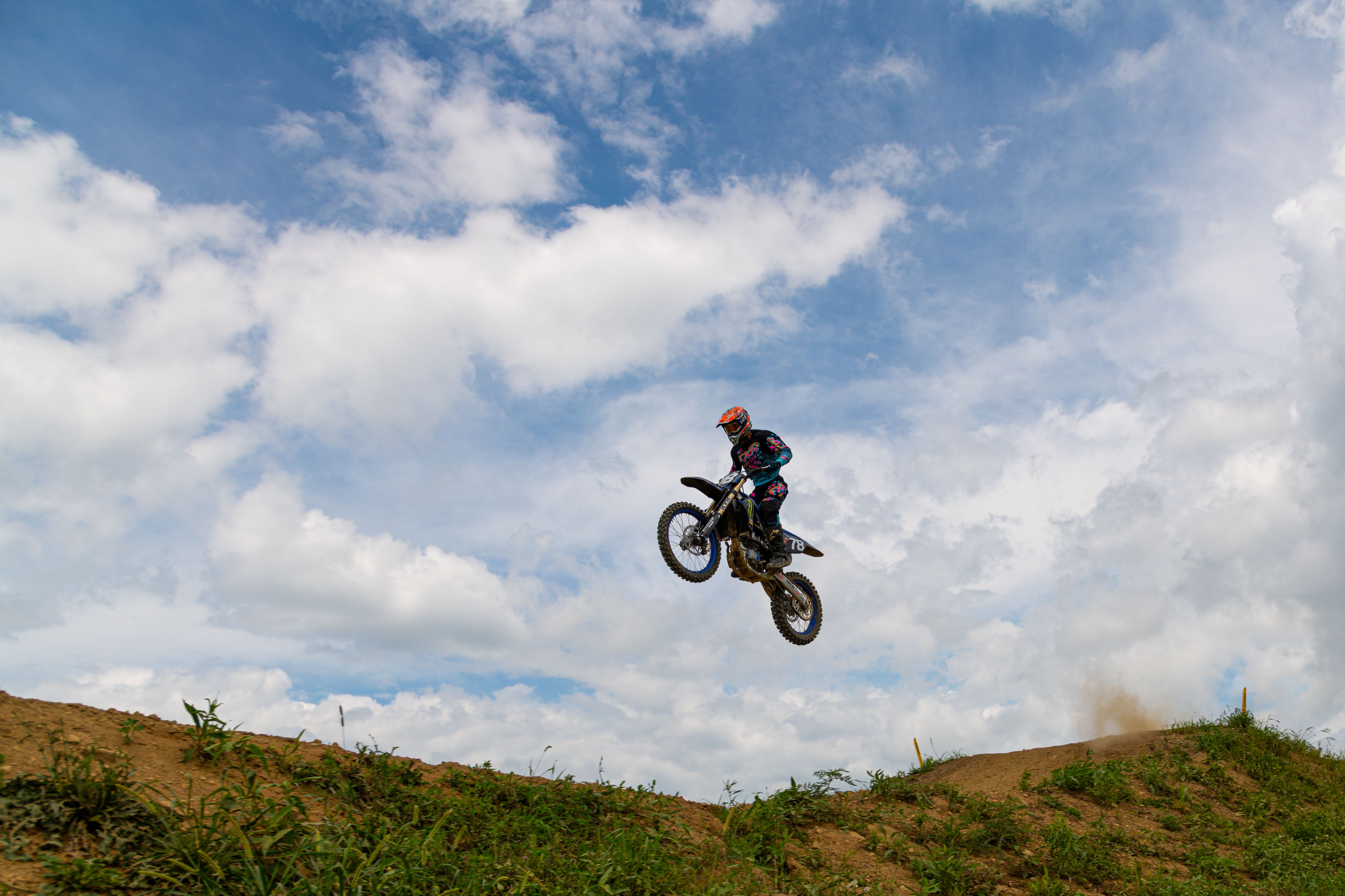 Dirt Bike Rider Jumping on Offroad Track · Free Stock Photo