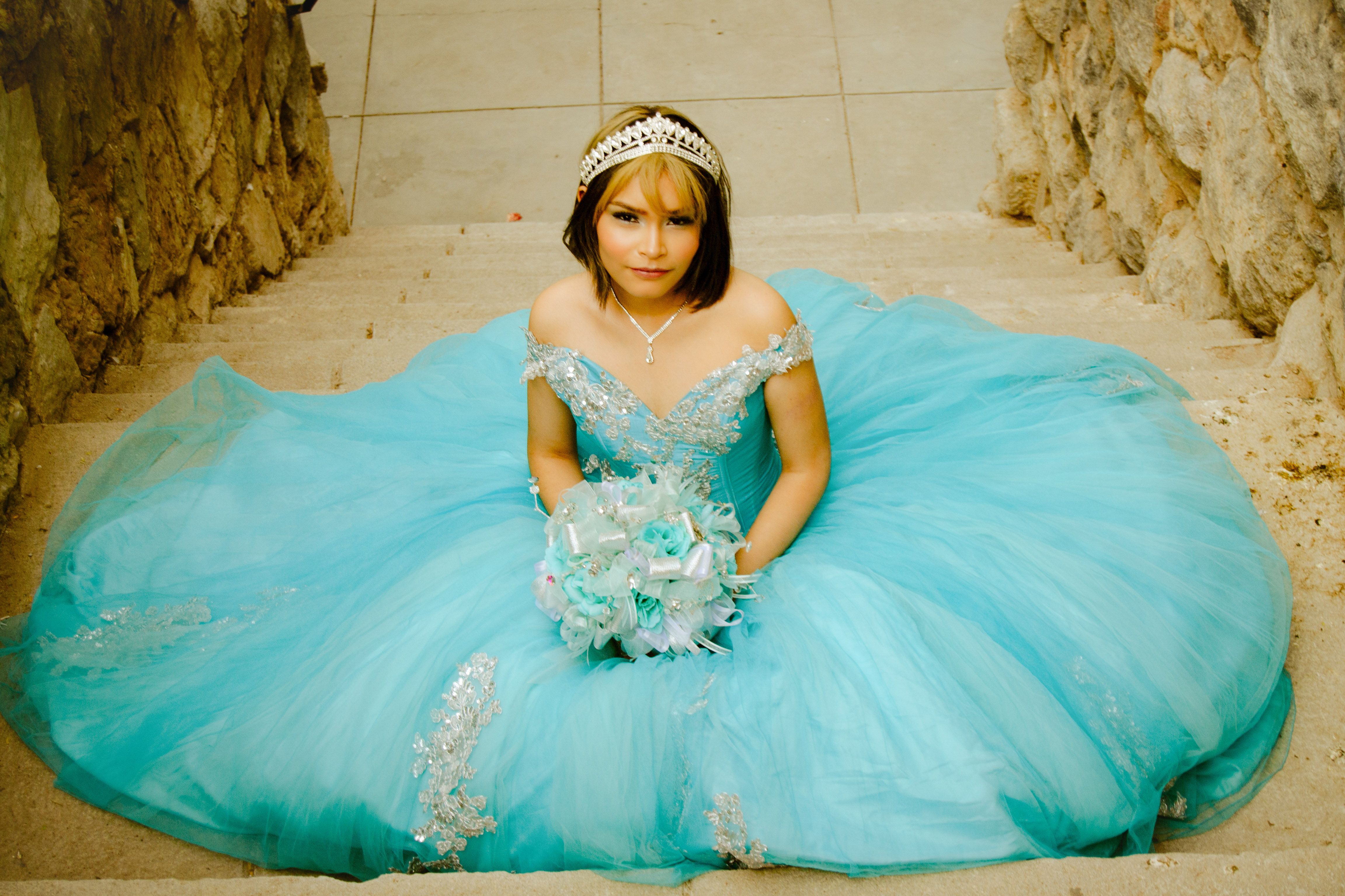 Elegant Quinceañera Portrait on Stone Steps · Free Stock Photo
