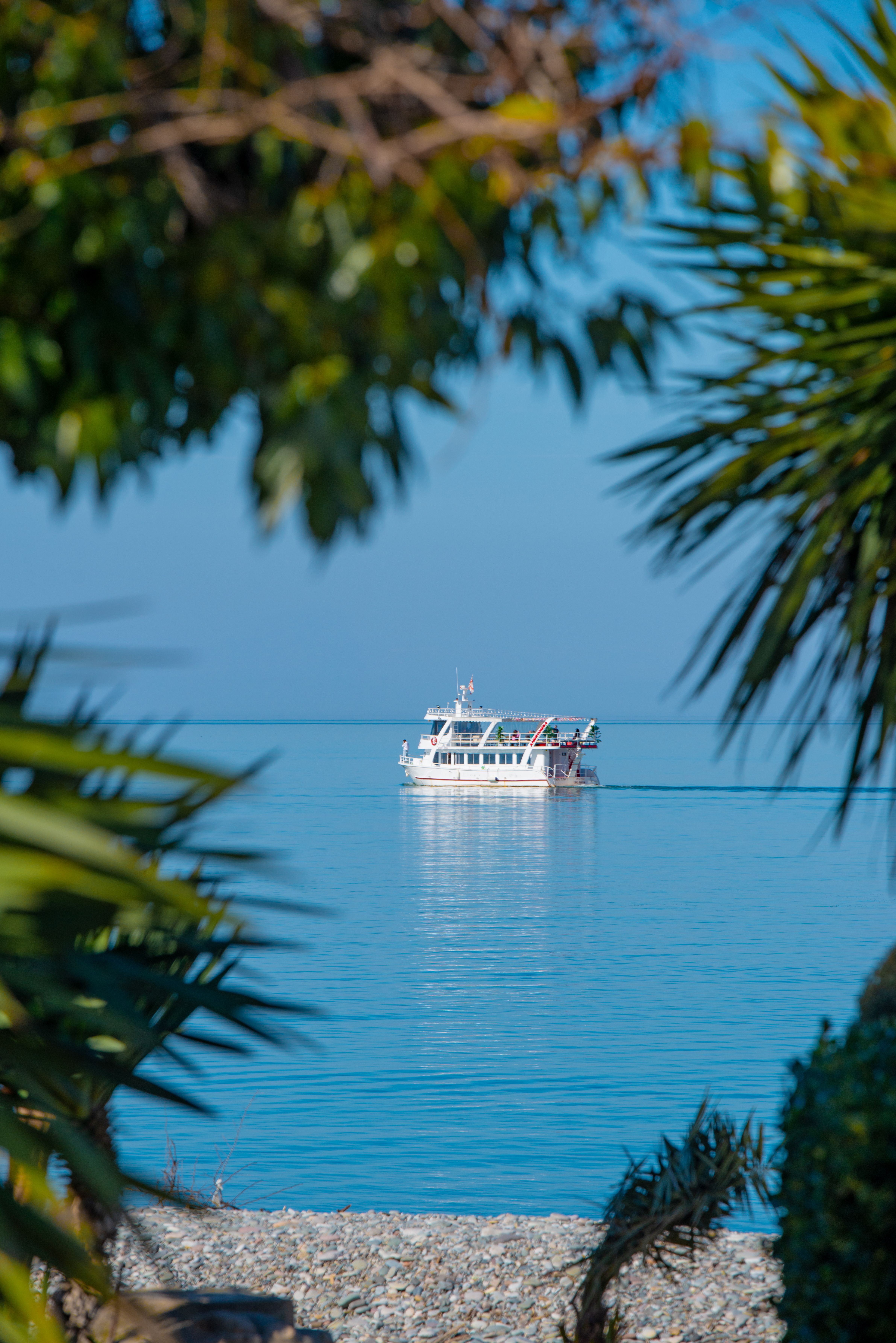 Scenic Boat Journey on Tranquil Blue Sea · Free Stock Photo