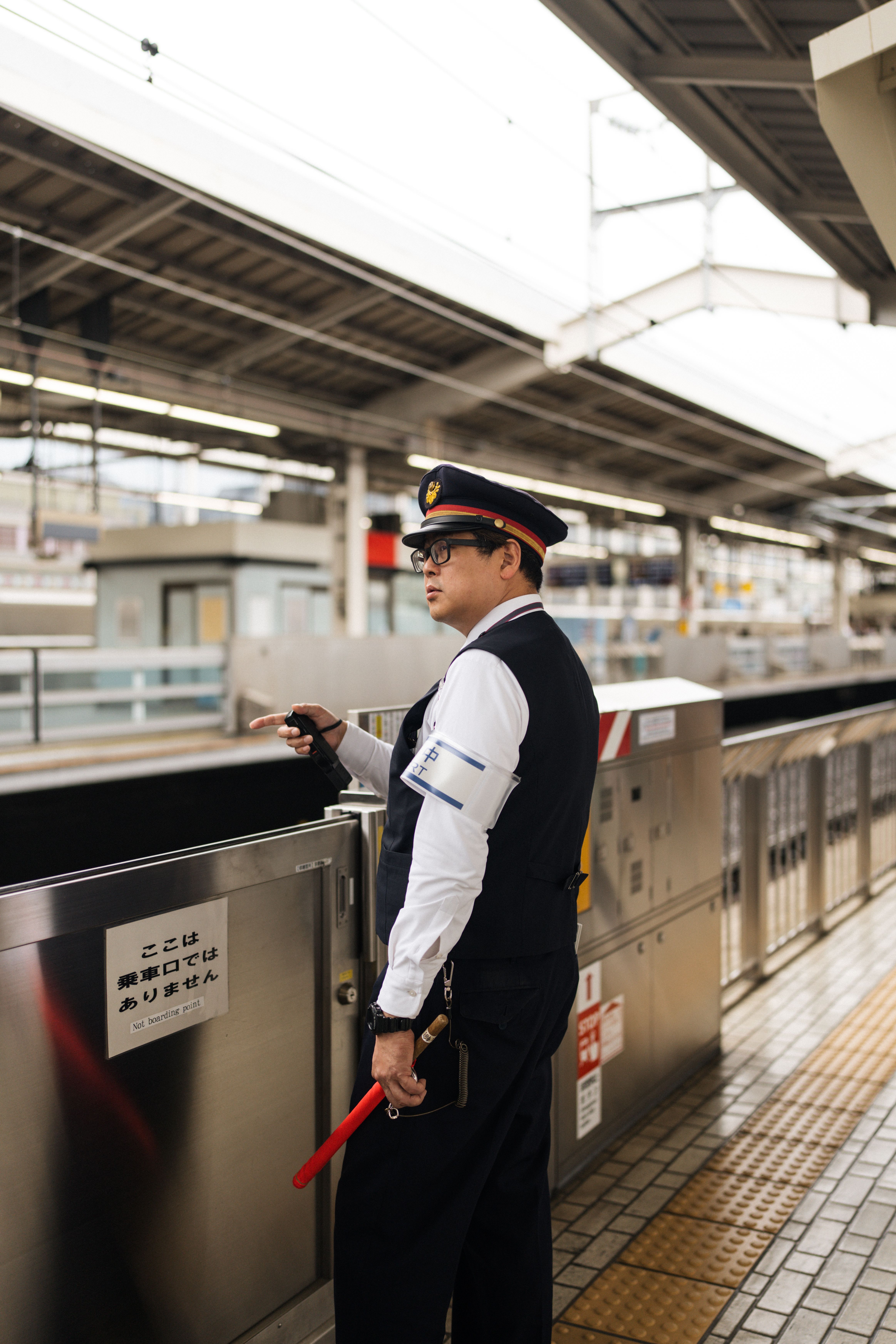 Security Officer at Japanese Train Station · Free Stock Photo