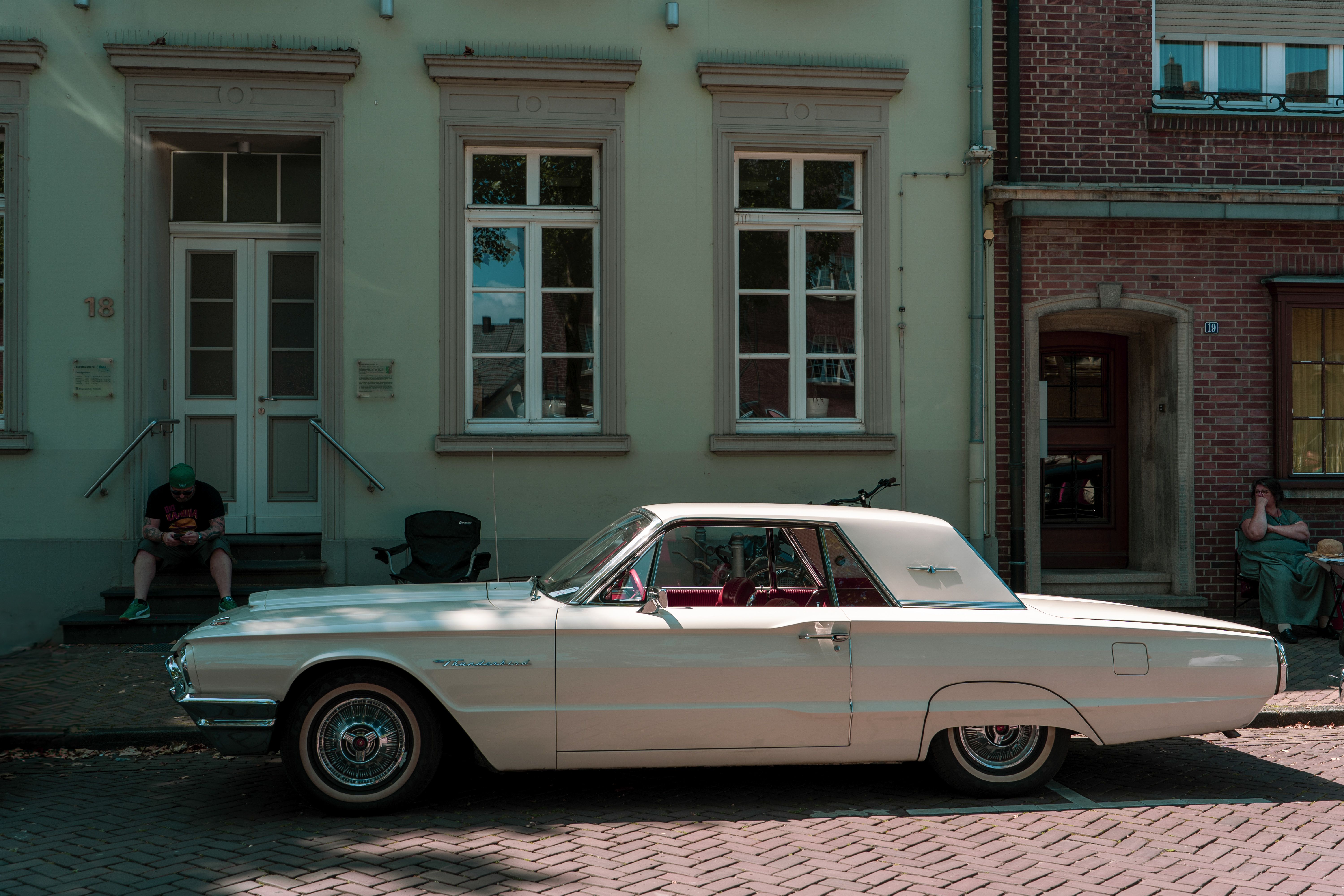 Vintage Car Parked on a Quiet Street · Free Stock Photo
