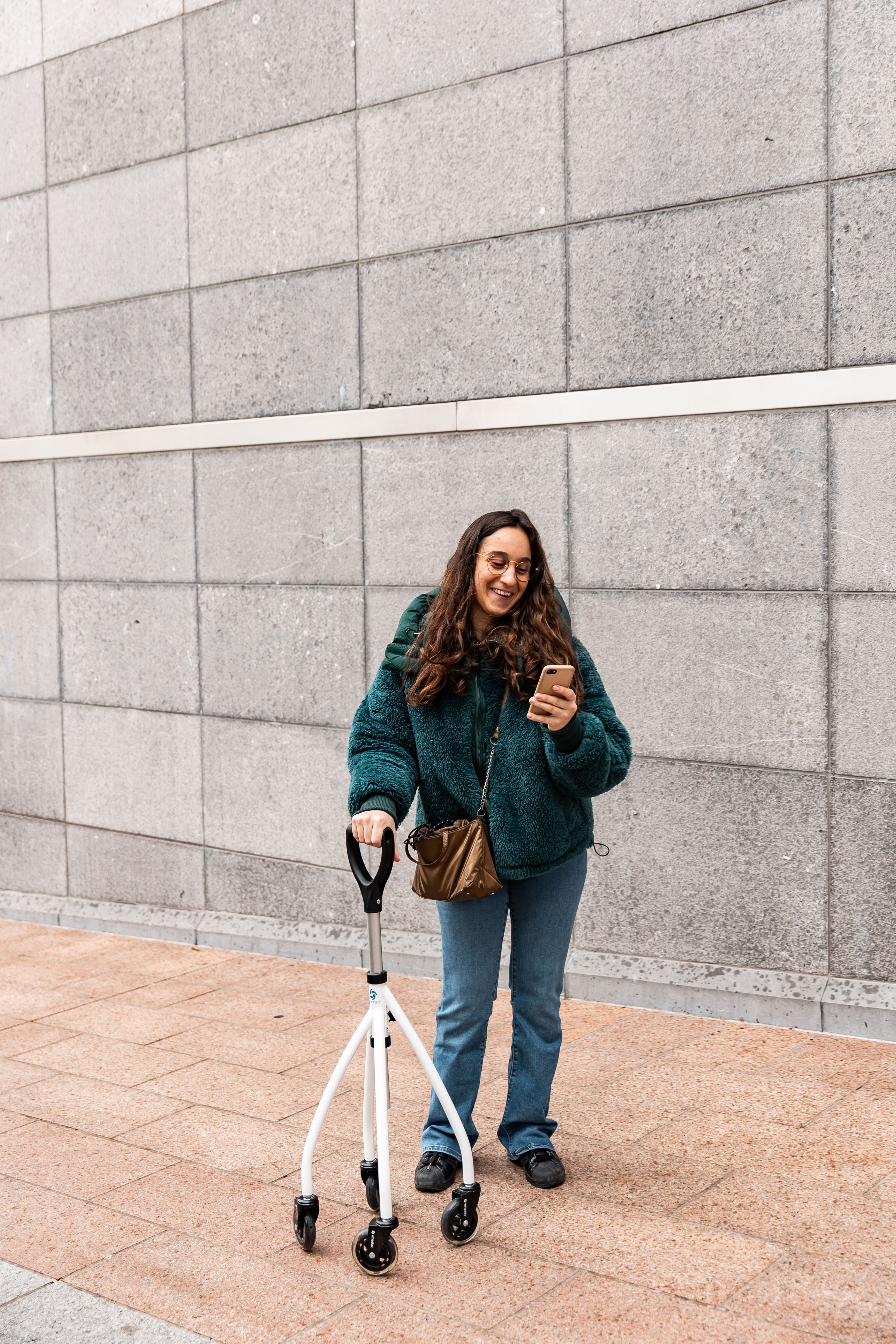 Young Woman with Rollator and Smiling Outdoors · Free Stock Photo