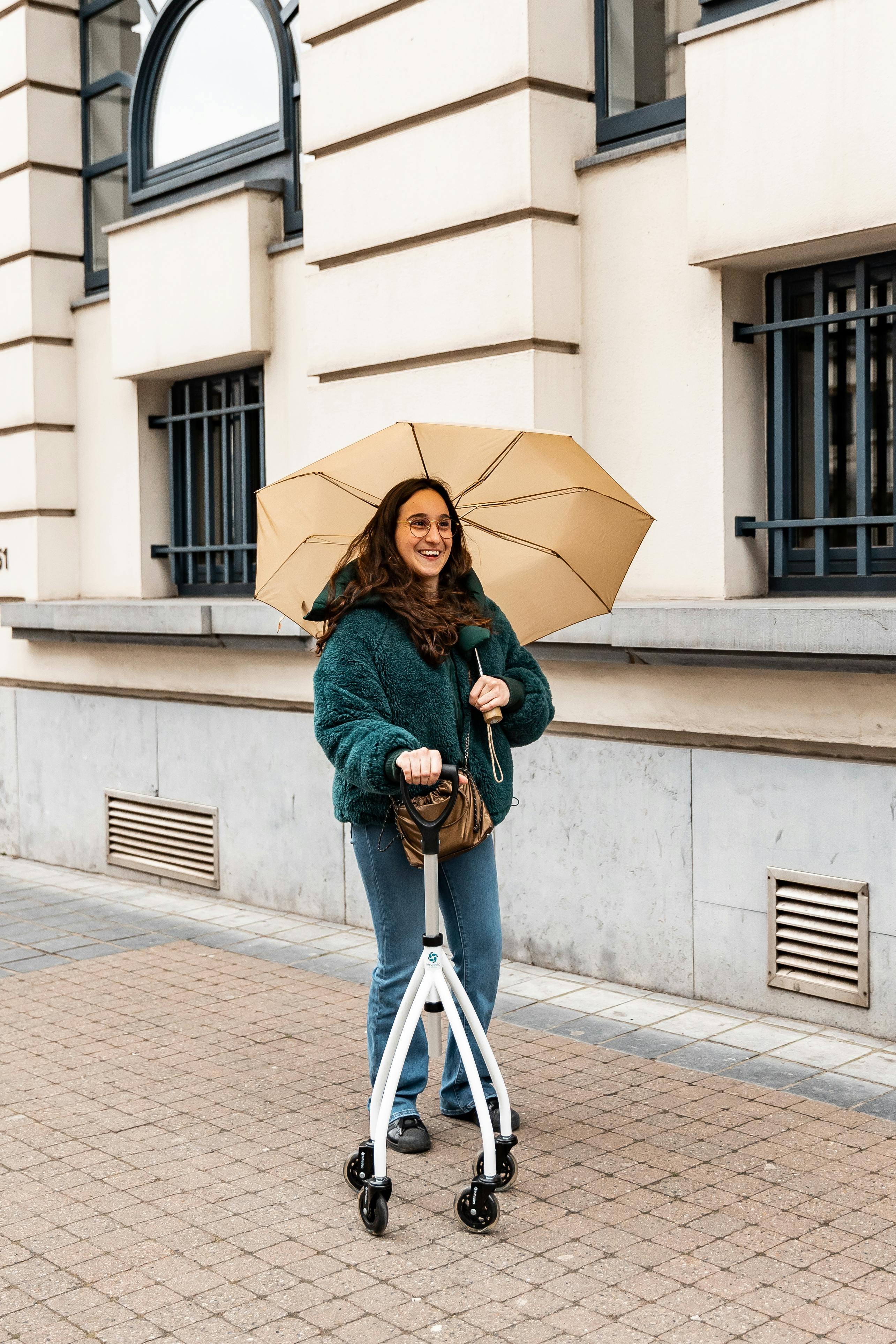 Stylish Woman with Rollator on City Street · Free Stock Photo
