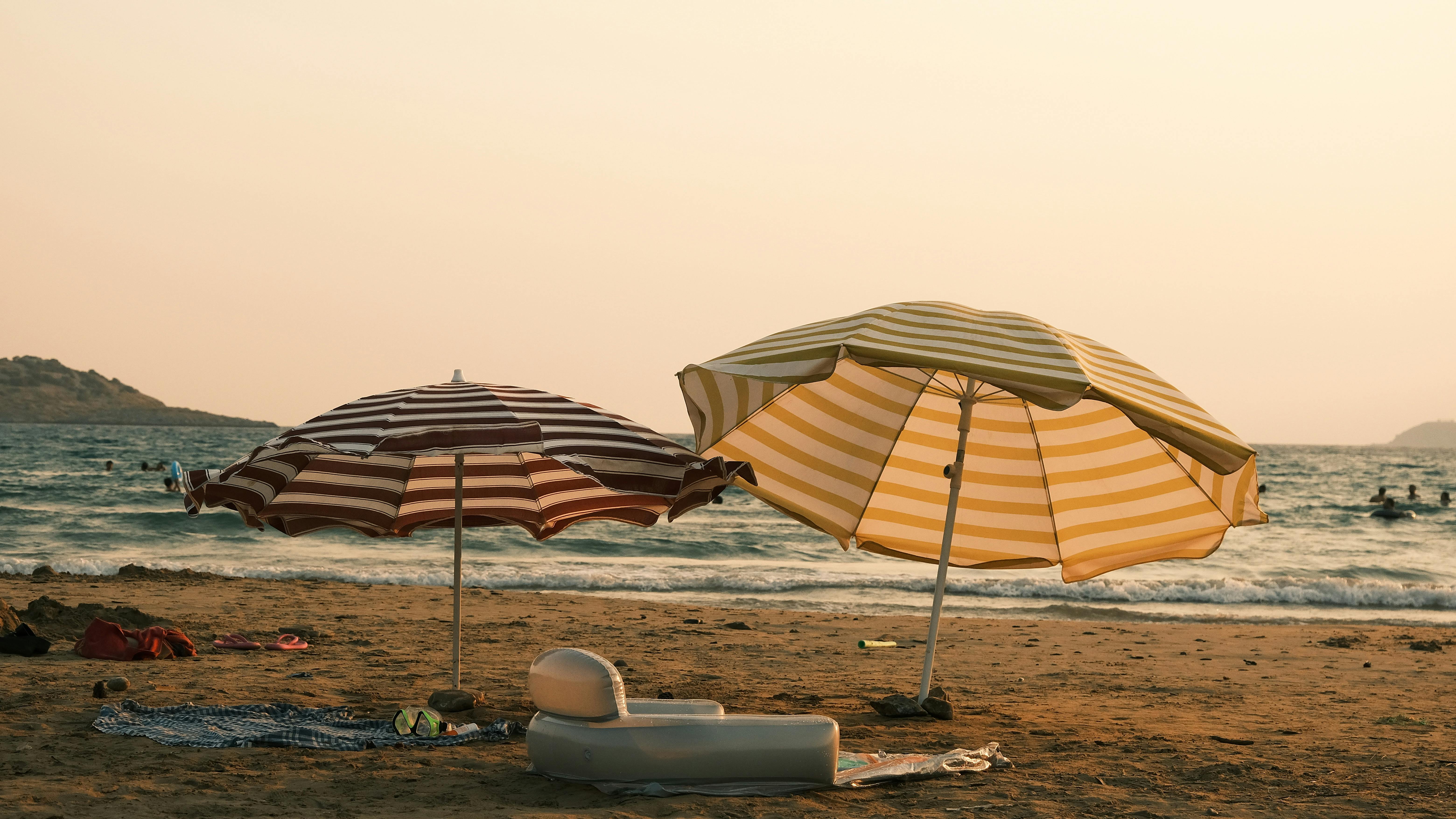 Bright Beach Scene with Colorful Umbrellas · Free Stock Photo