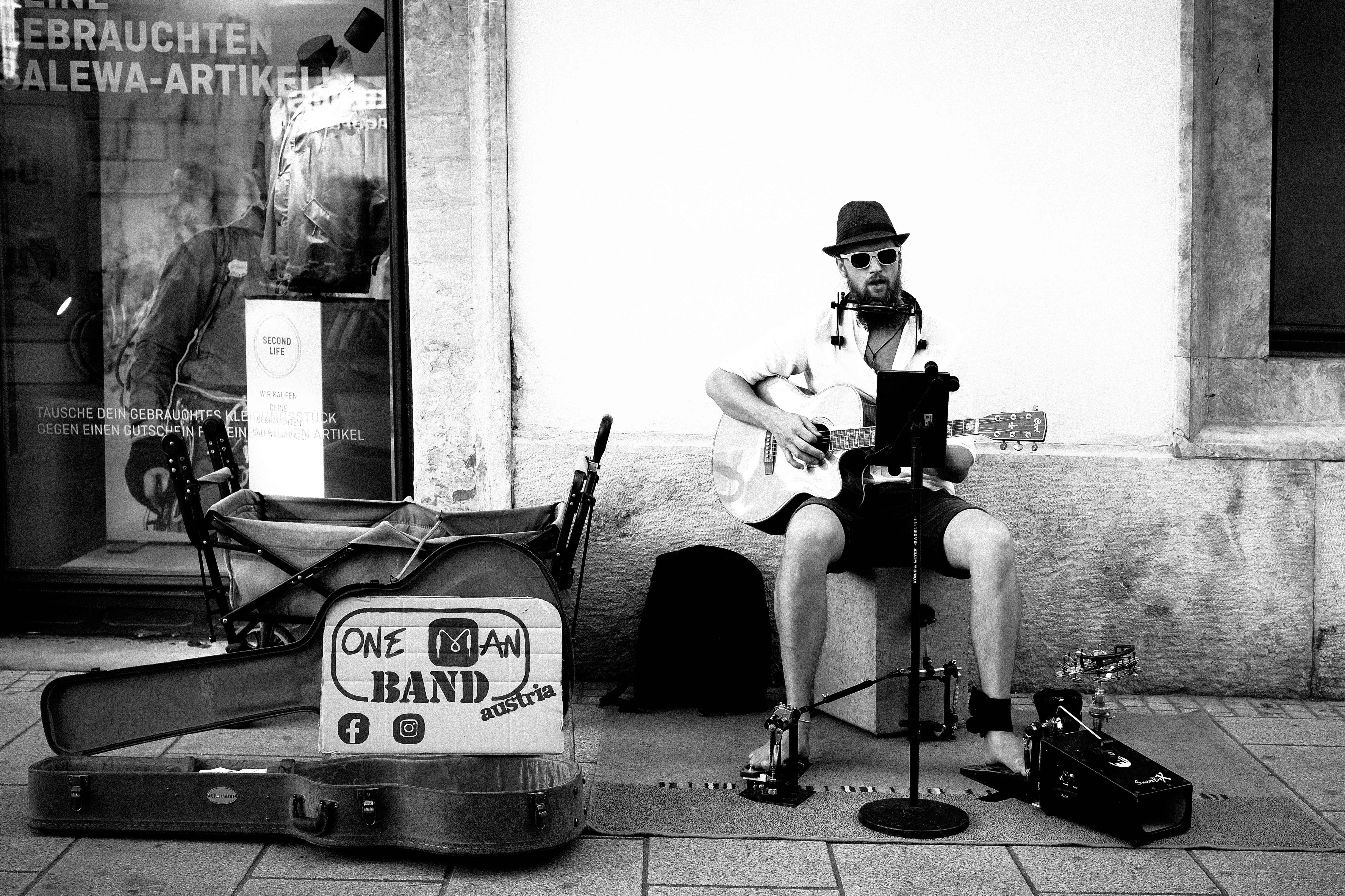 Street Musician Performing as a One-Man Band · Free Stock Photo