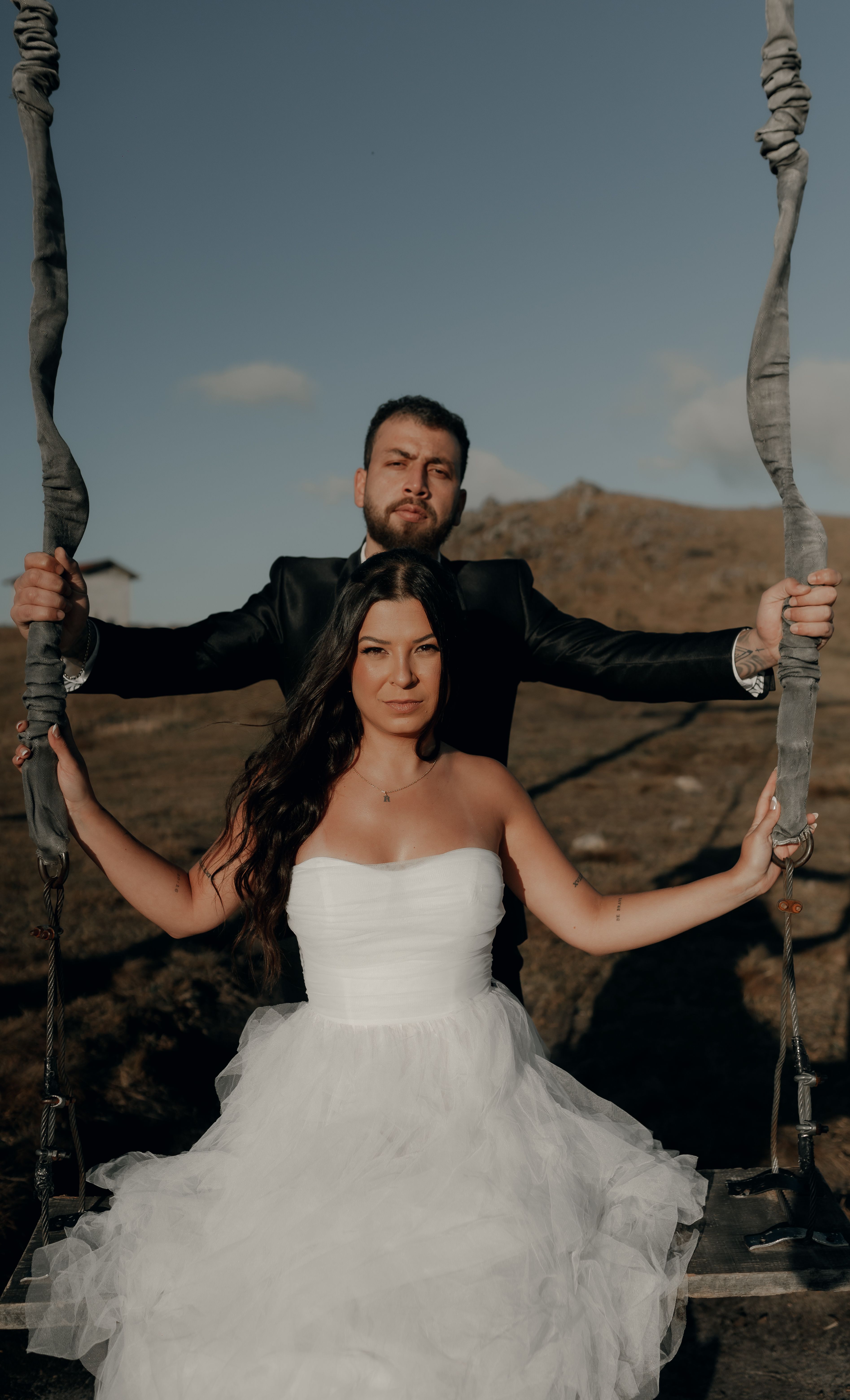 Elegant Wedding Couple on Rustic Swing Outdoors · Free Stock Photo