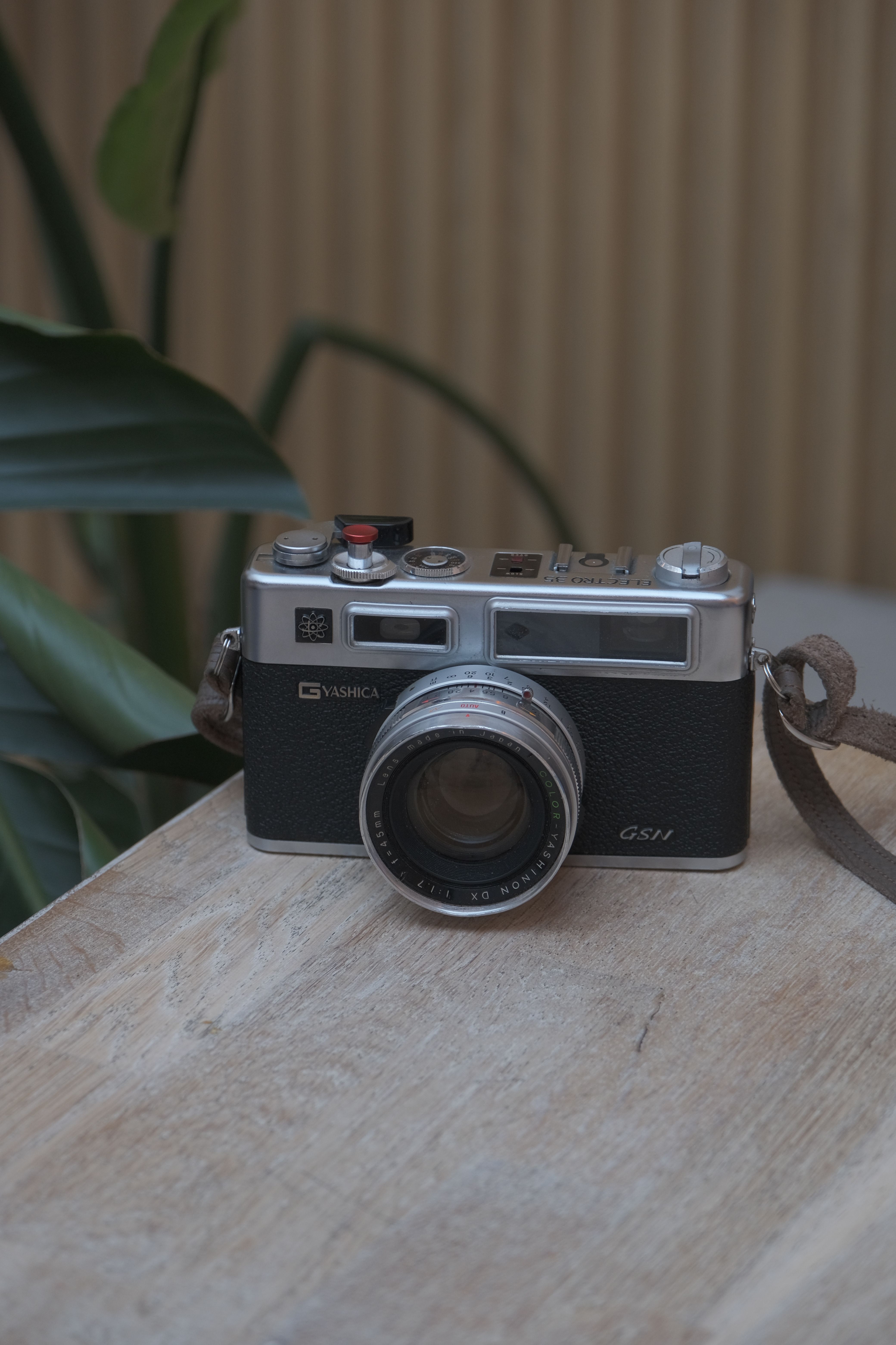 Vintage Camera on Wooden Table Indoors · Free Stock Photo