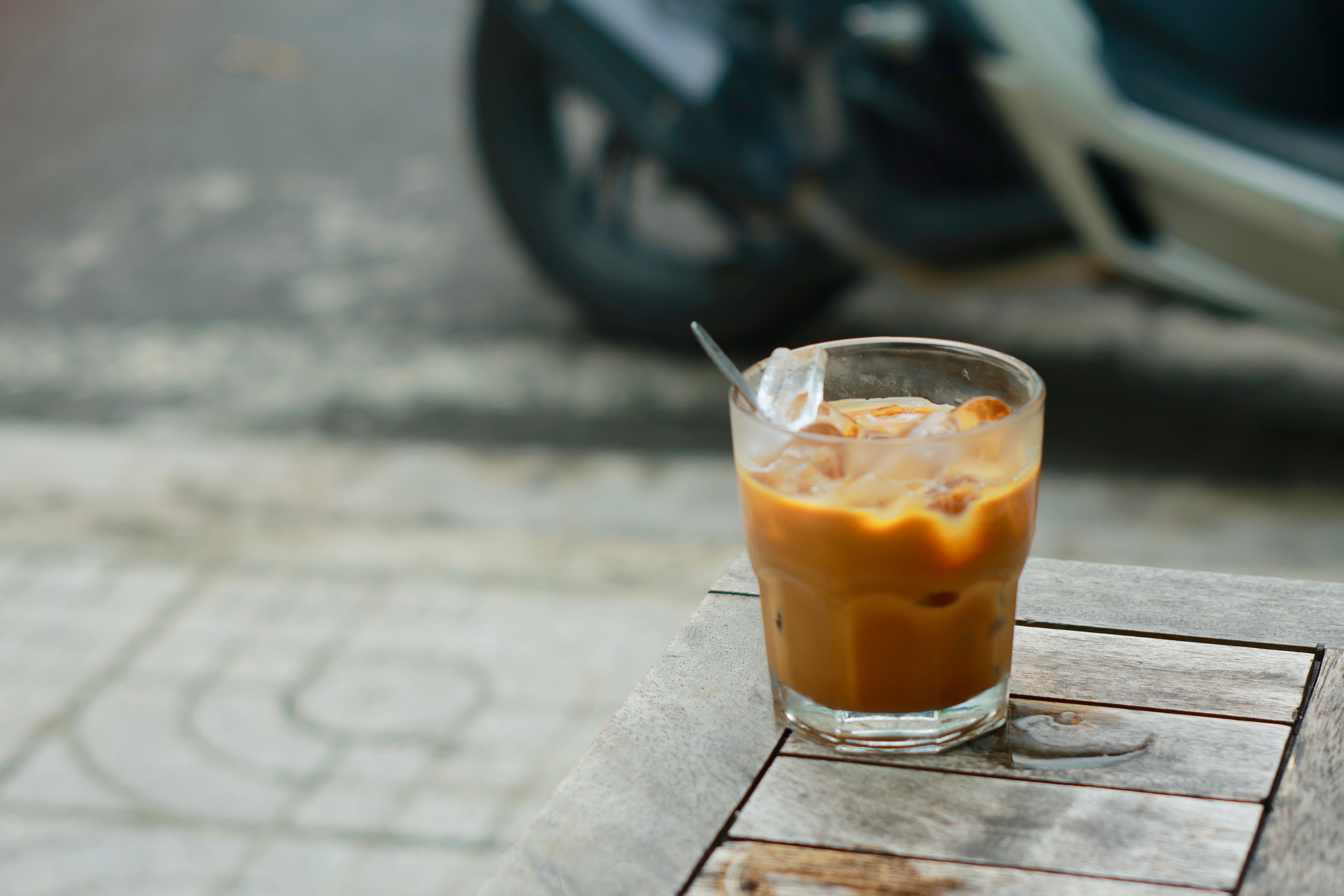 Refreshing Iced Coffee on Rustic Table Outdoors · Free Stock Photo