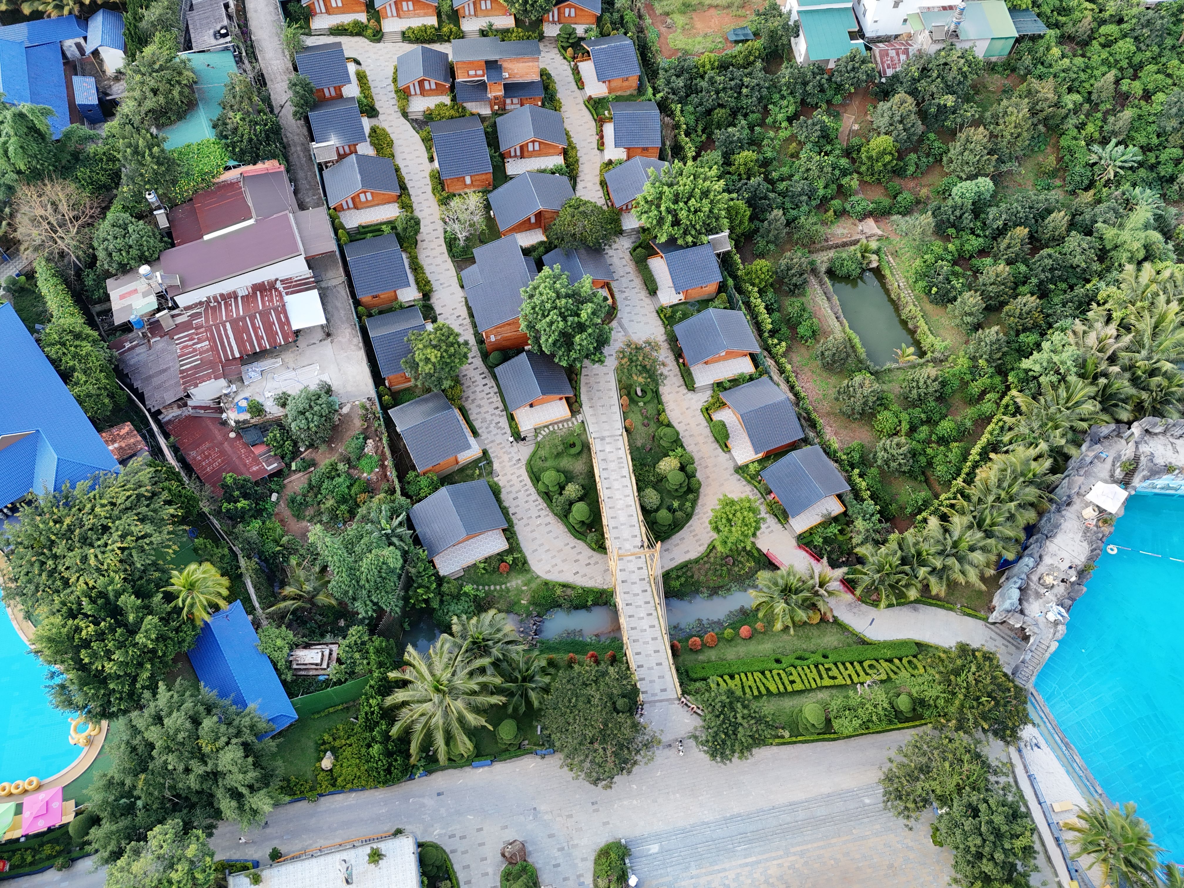 Aerial View of Scenic Resort with Wooden Cabins · Free Stock Photo