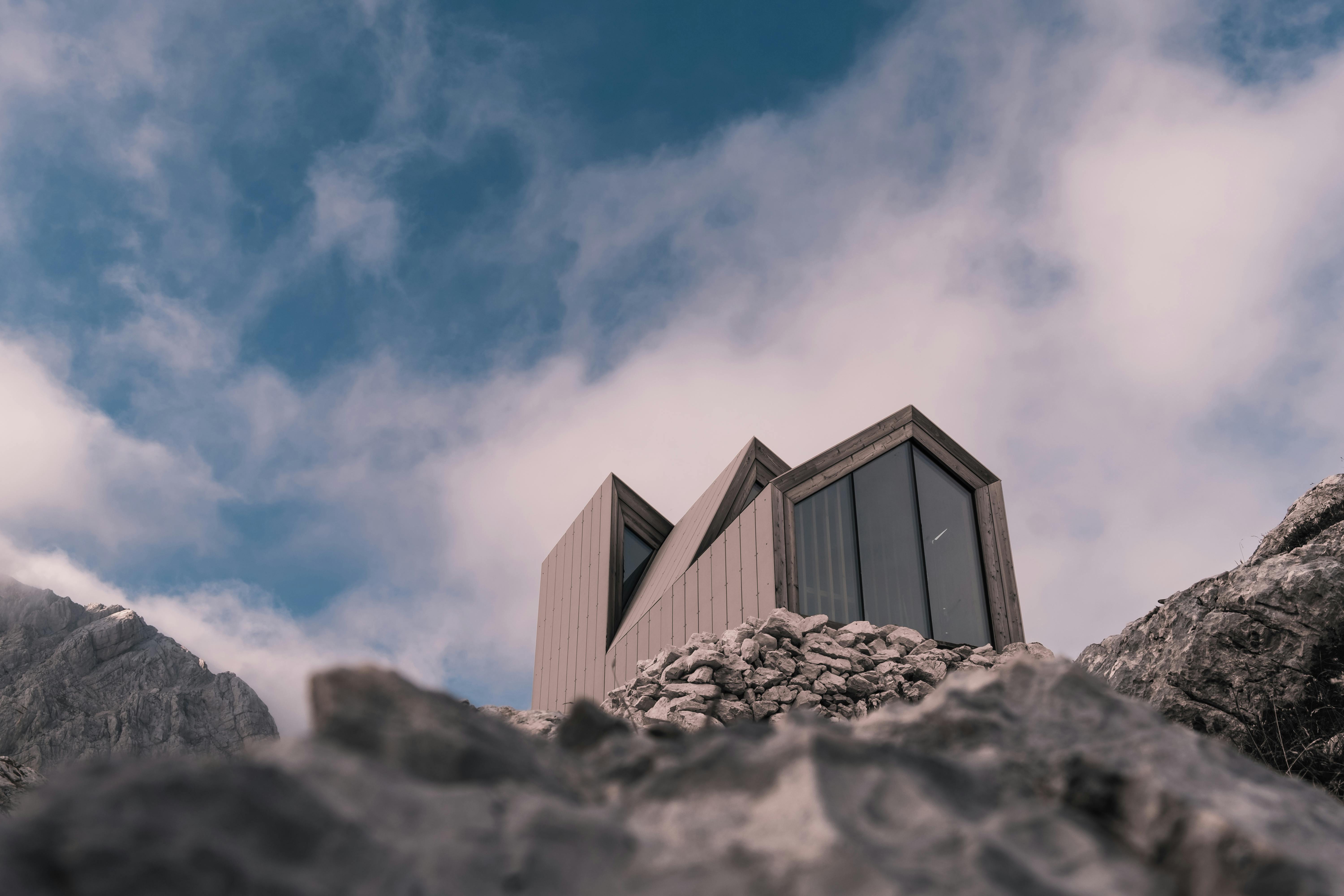 Photo Of Building On Top Of Rocks · Free Stock Photo