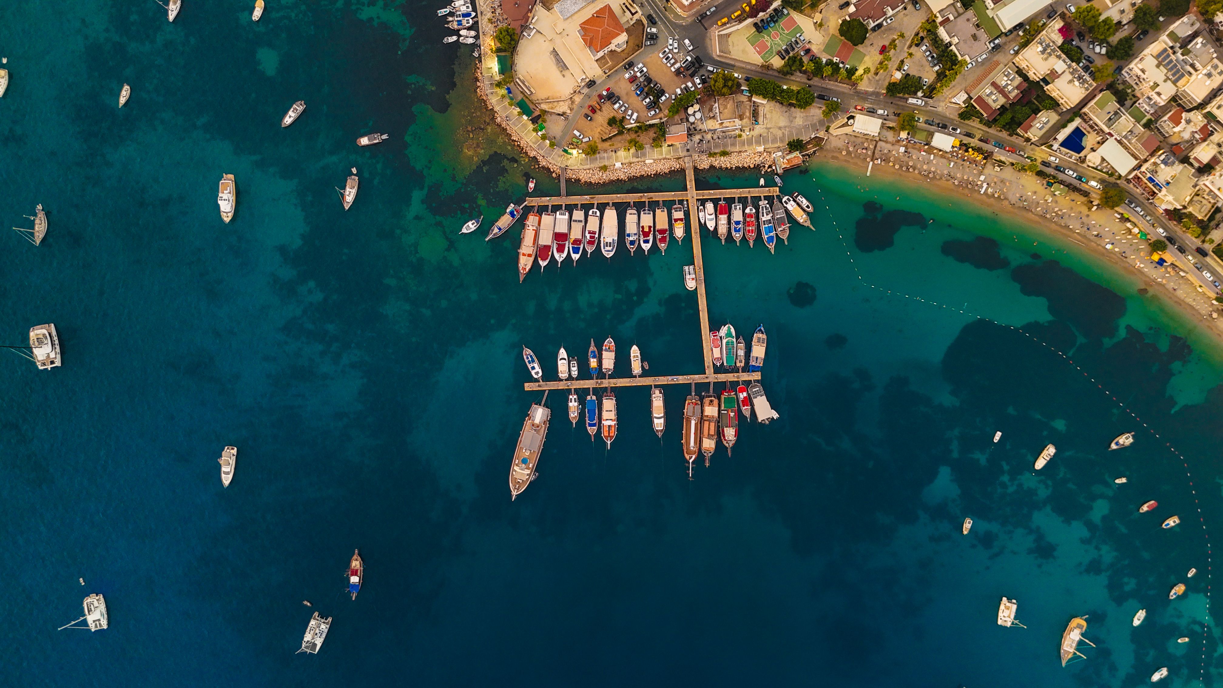 Aerial View of Boats Docked at Seaside Marina · Free Stock Photo