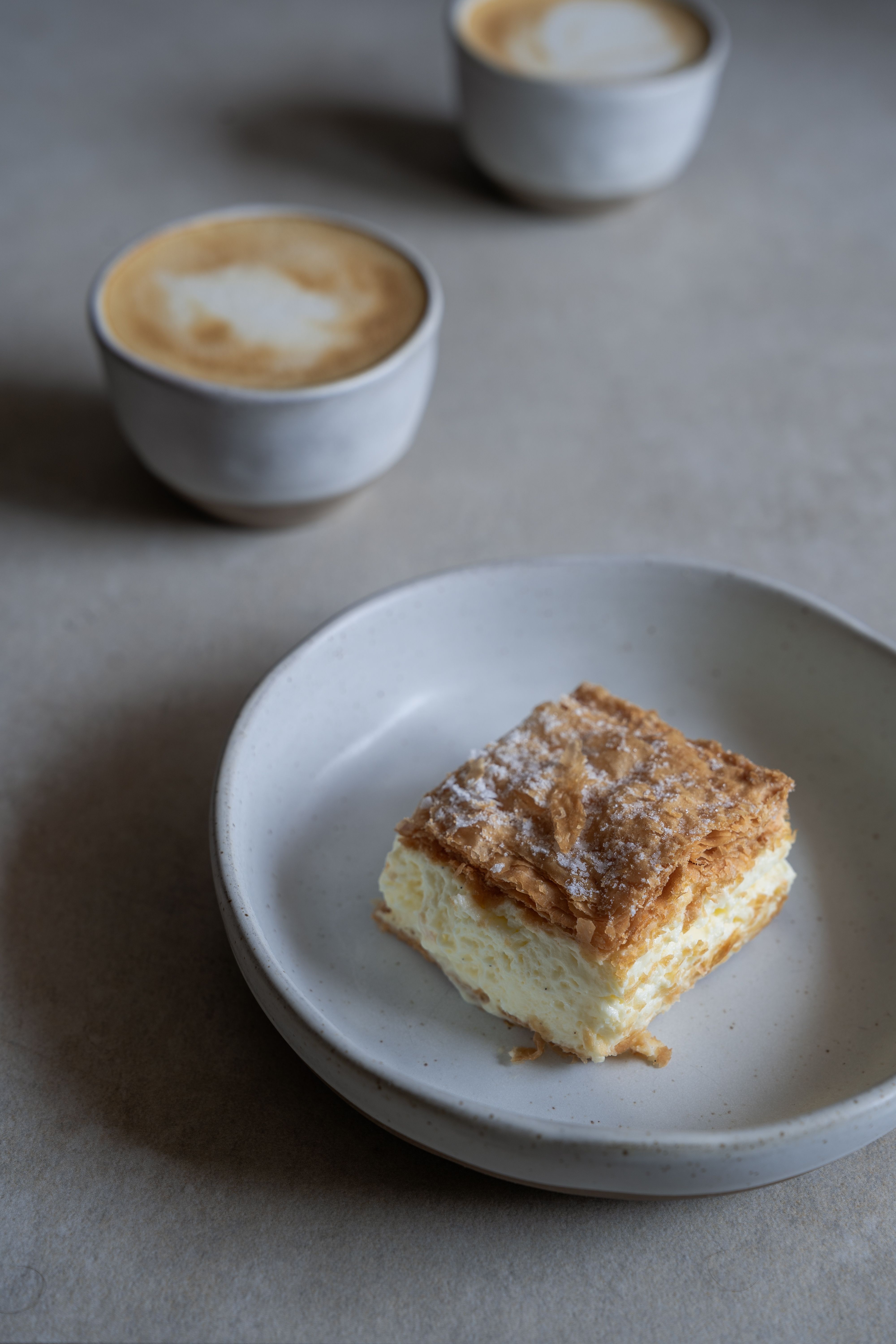 Delicious Vanilla Cream Pastry with Cappuccinos · Free Stock Photo