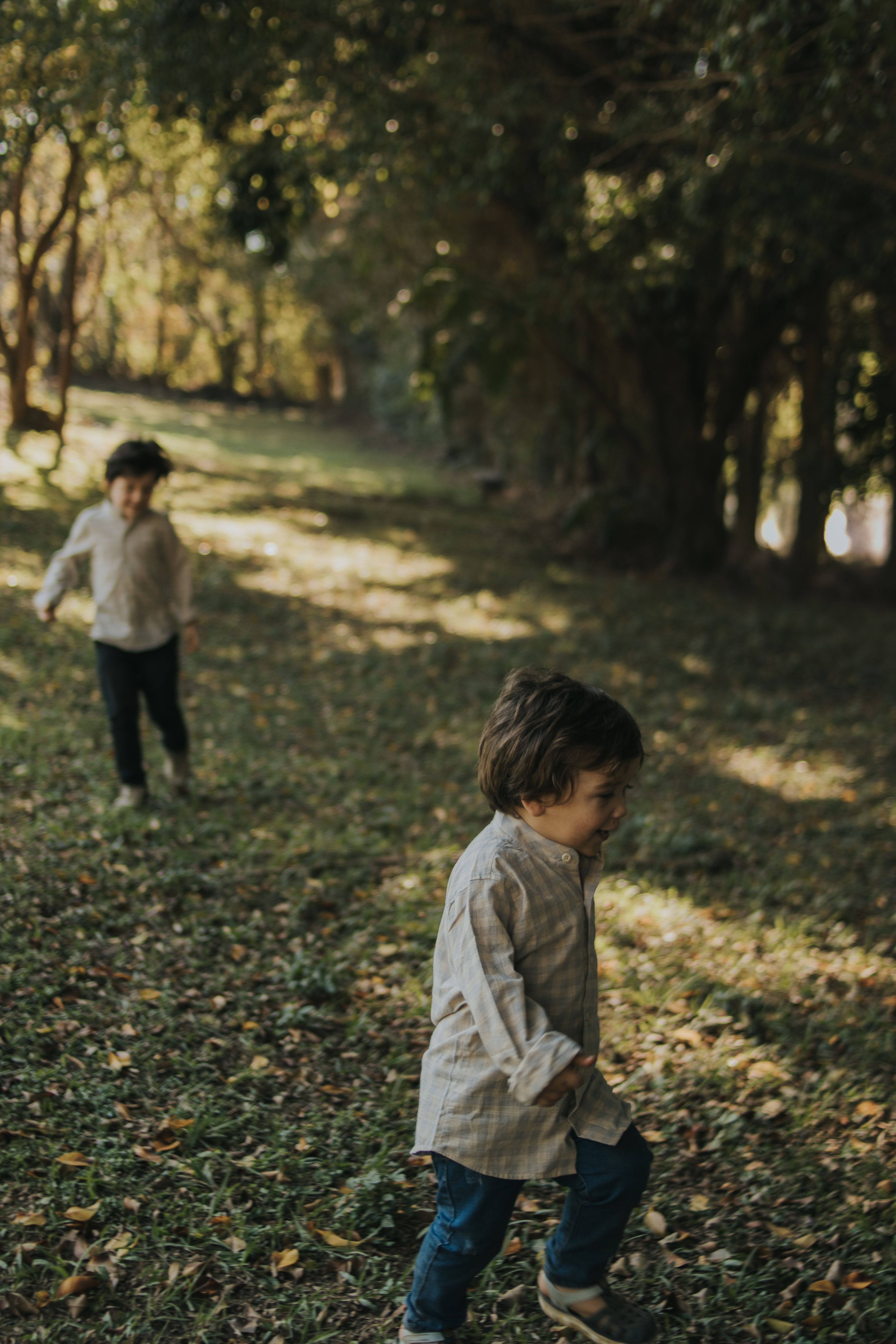 Two Young Boys Playing Outdoors in Autumn · Free Stock Photo