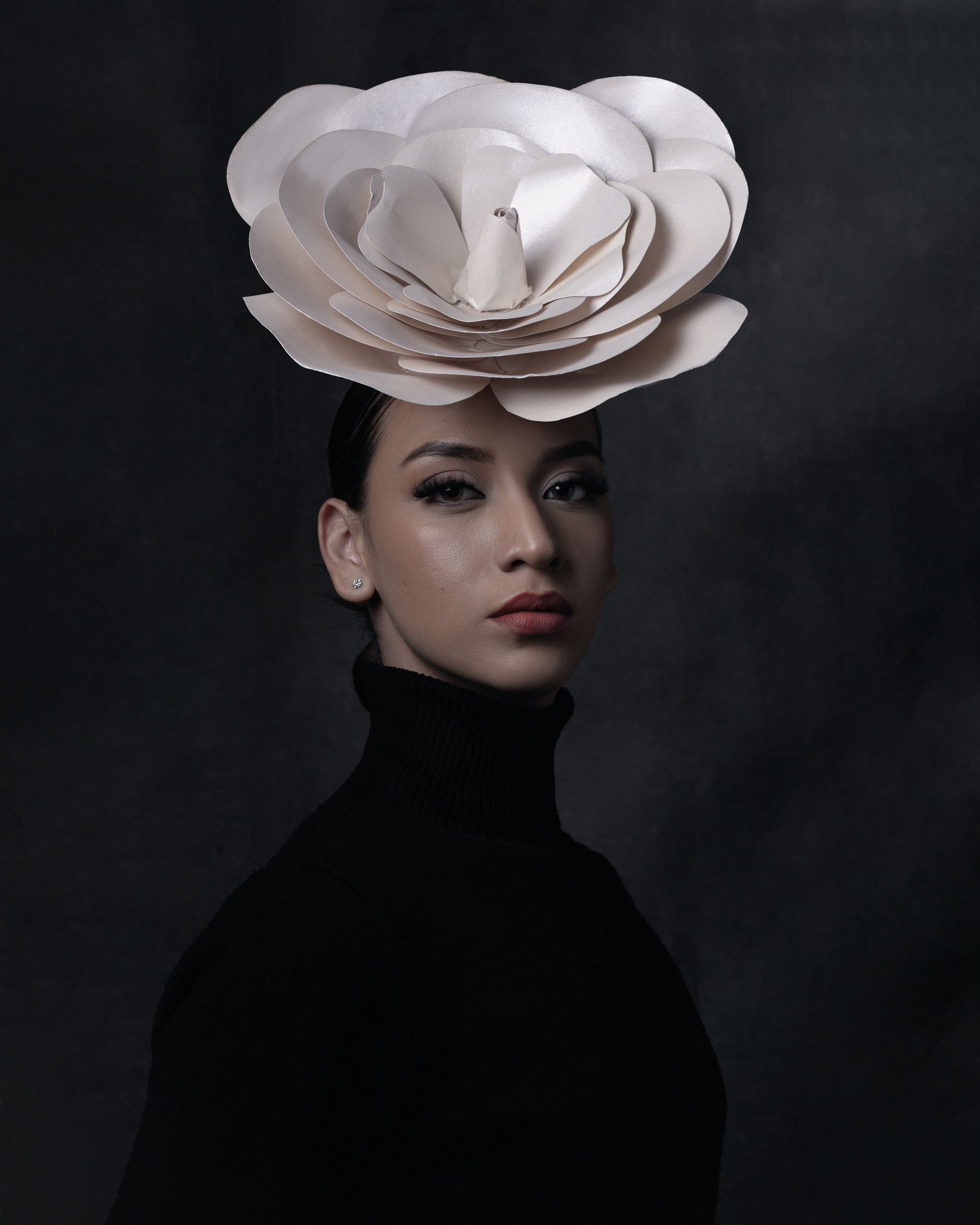 Elegant Woman with Large Floral Headpiece Portrait · Free Stock Photo